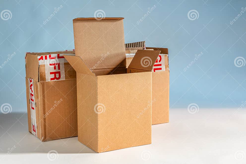 Empty Cardboard Boxes on White and Blue Background Stock Photo - Image ...