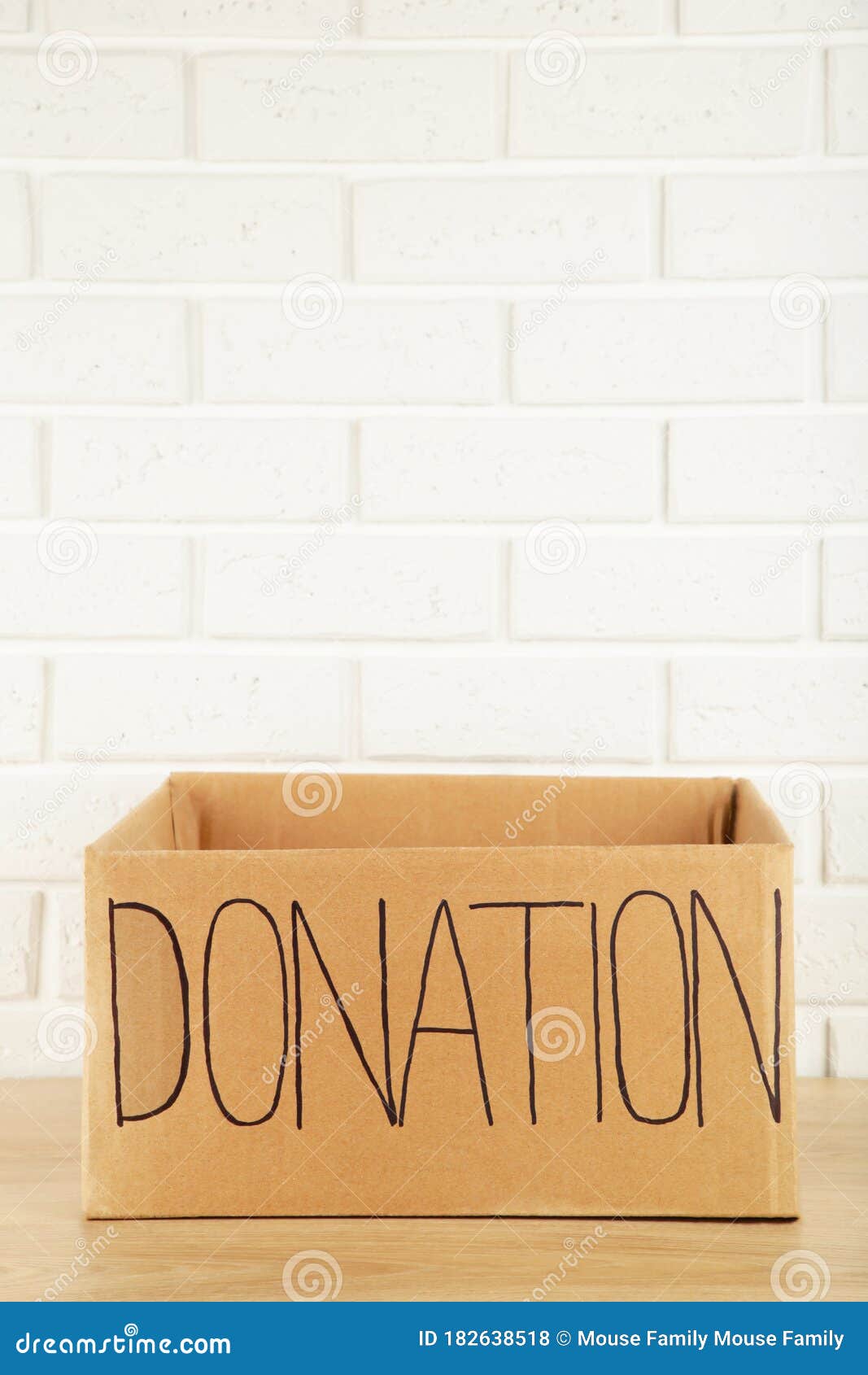 Empty Cardboard Donation Box on White Brick Wall Background ...