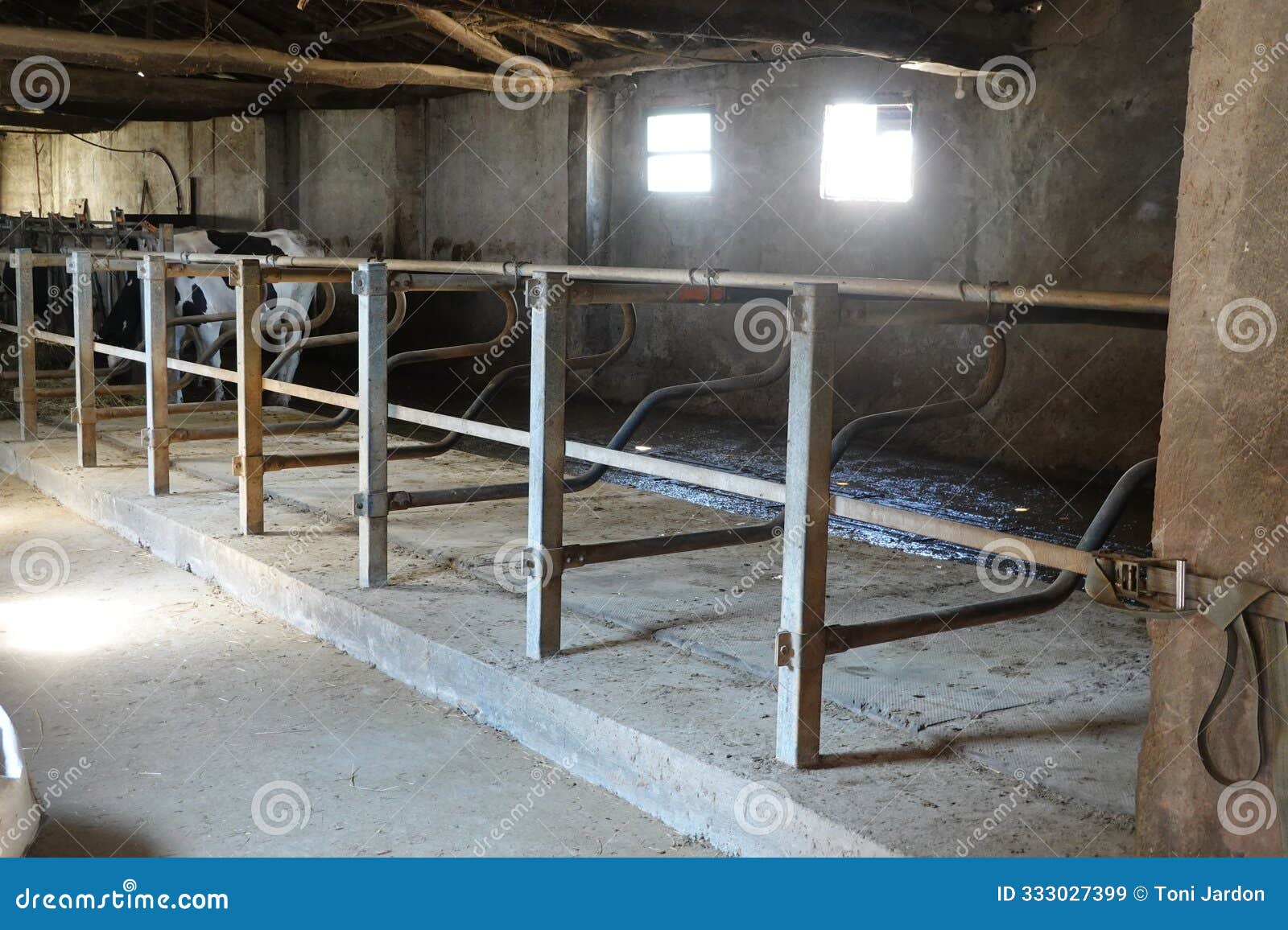Empty Cattle Paddock In The Foreground With A Hay Feeder Stock Photo ...
