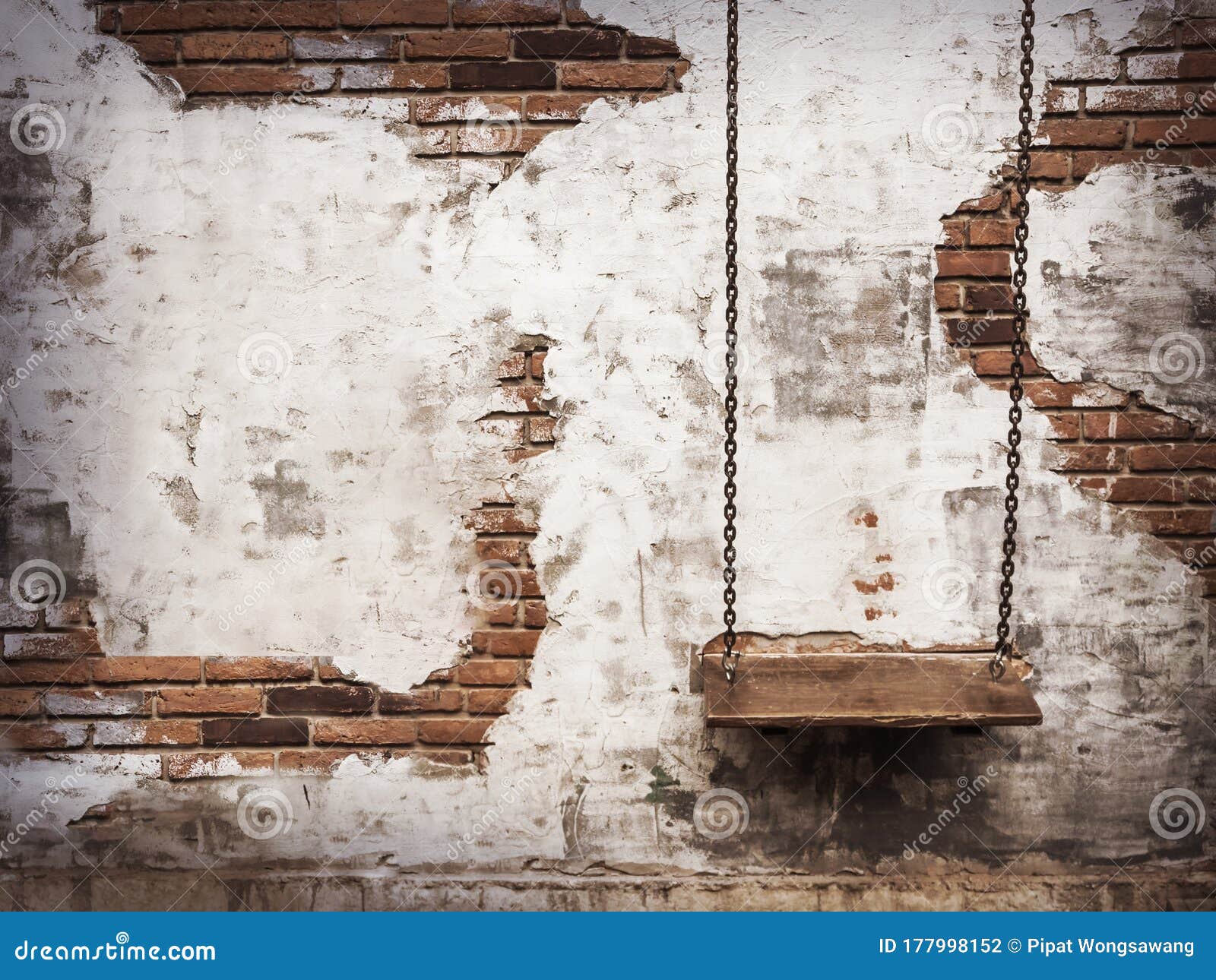 Empty Chain Swing Against Old Brick Wall Background Stock Photo - Image ...
