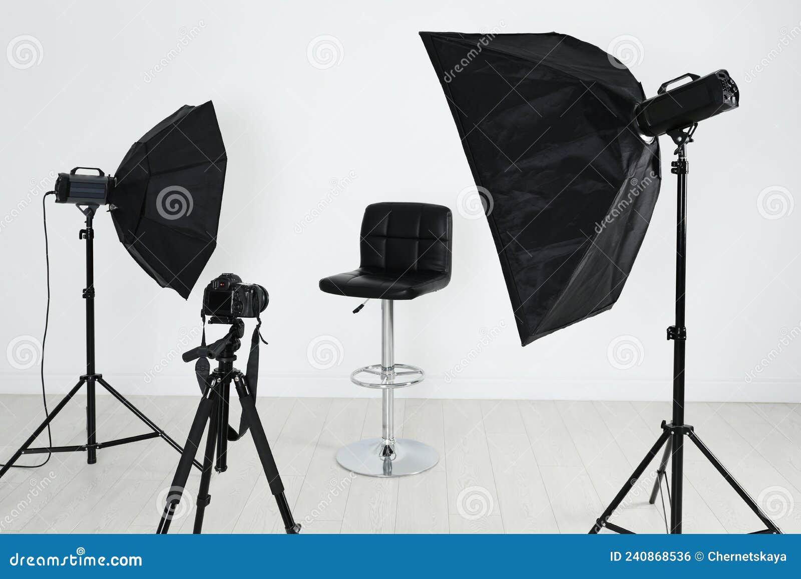 Empty Chair in Front of Camera and Professional Lighting Equipment ...