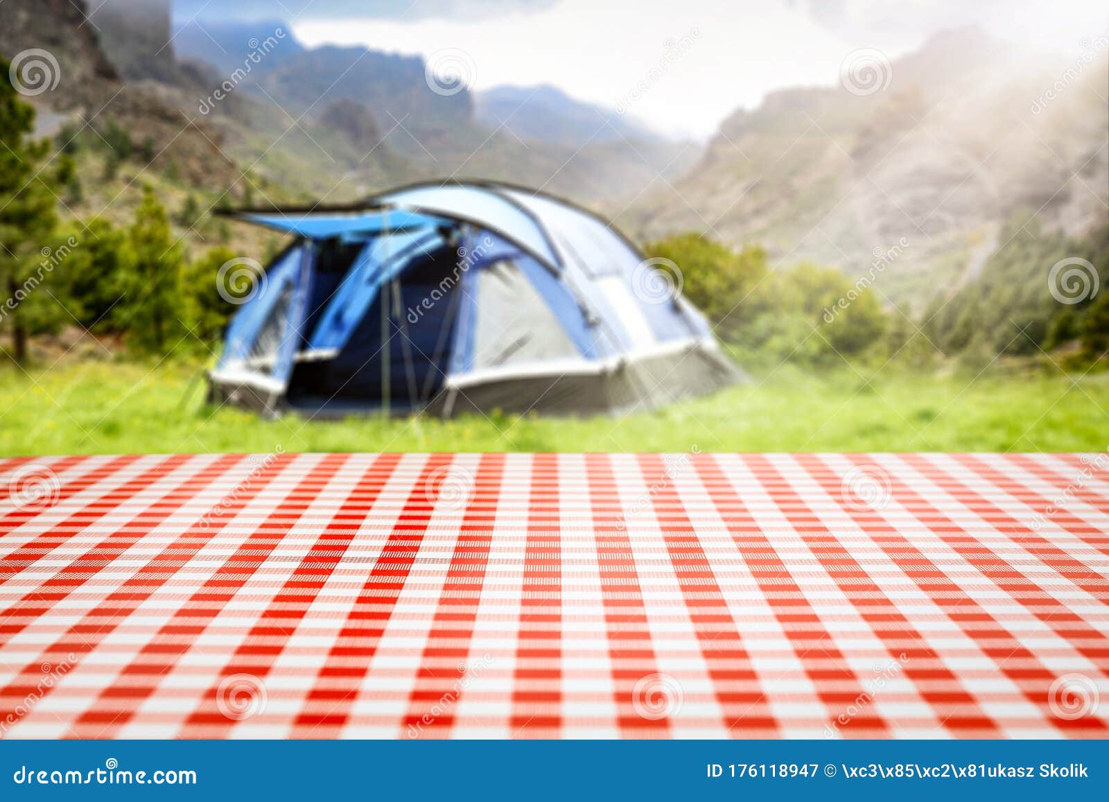 Empty Checkered Table on the Grass Field. Blurry Camping Tent and ...