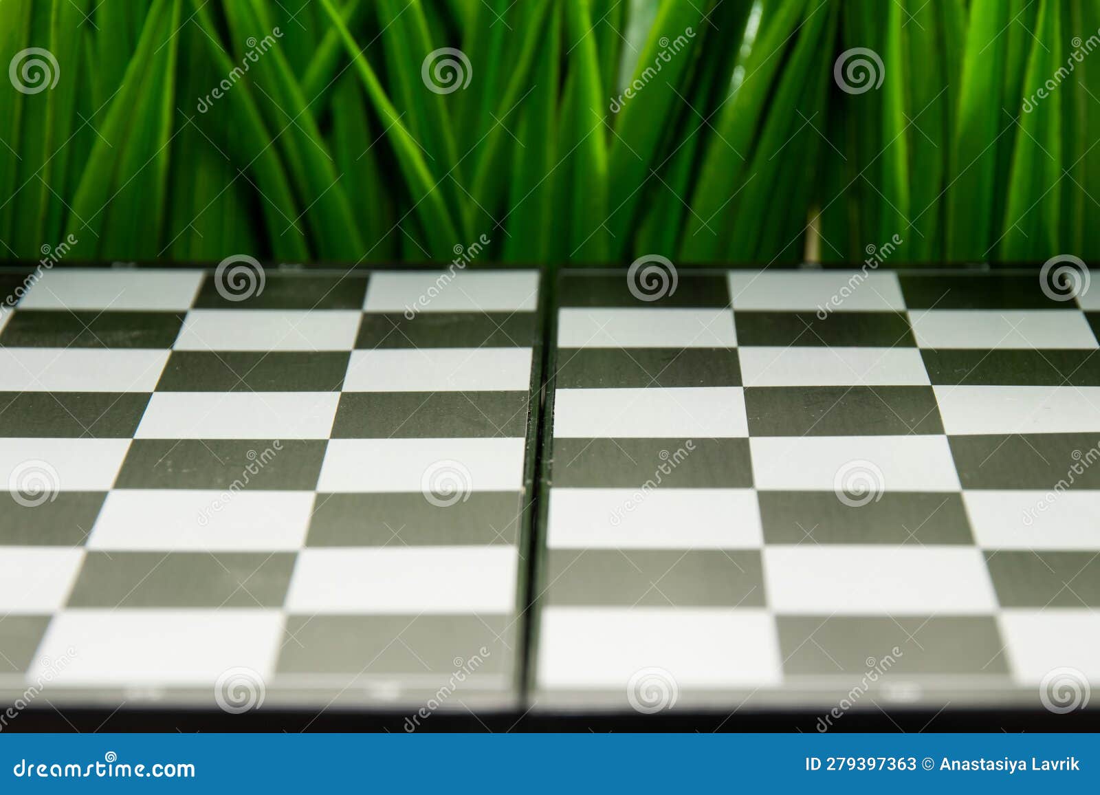Empty Chess Board Against Green Grass Background Stock Image - Image of ...