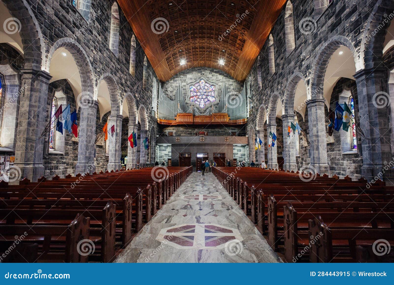Empty Church Interior Featuring a Stained Glass Window and Stone Walls ...
