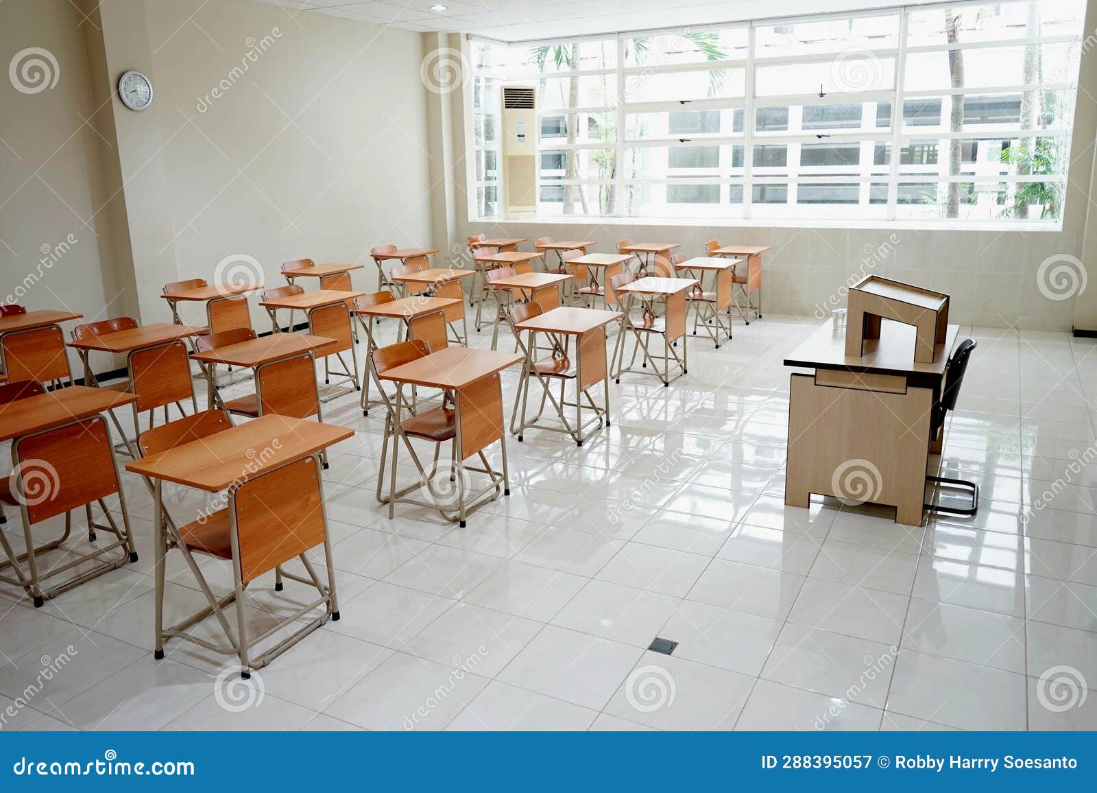 Empty Classroom with Lots of Benches and a Wall Clock Stock Image ...