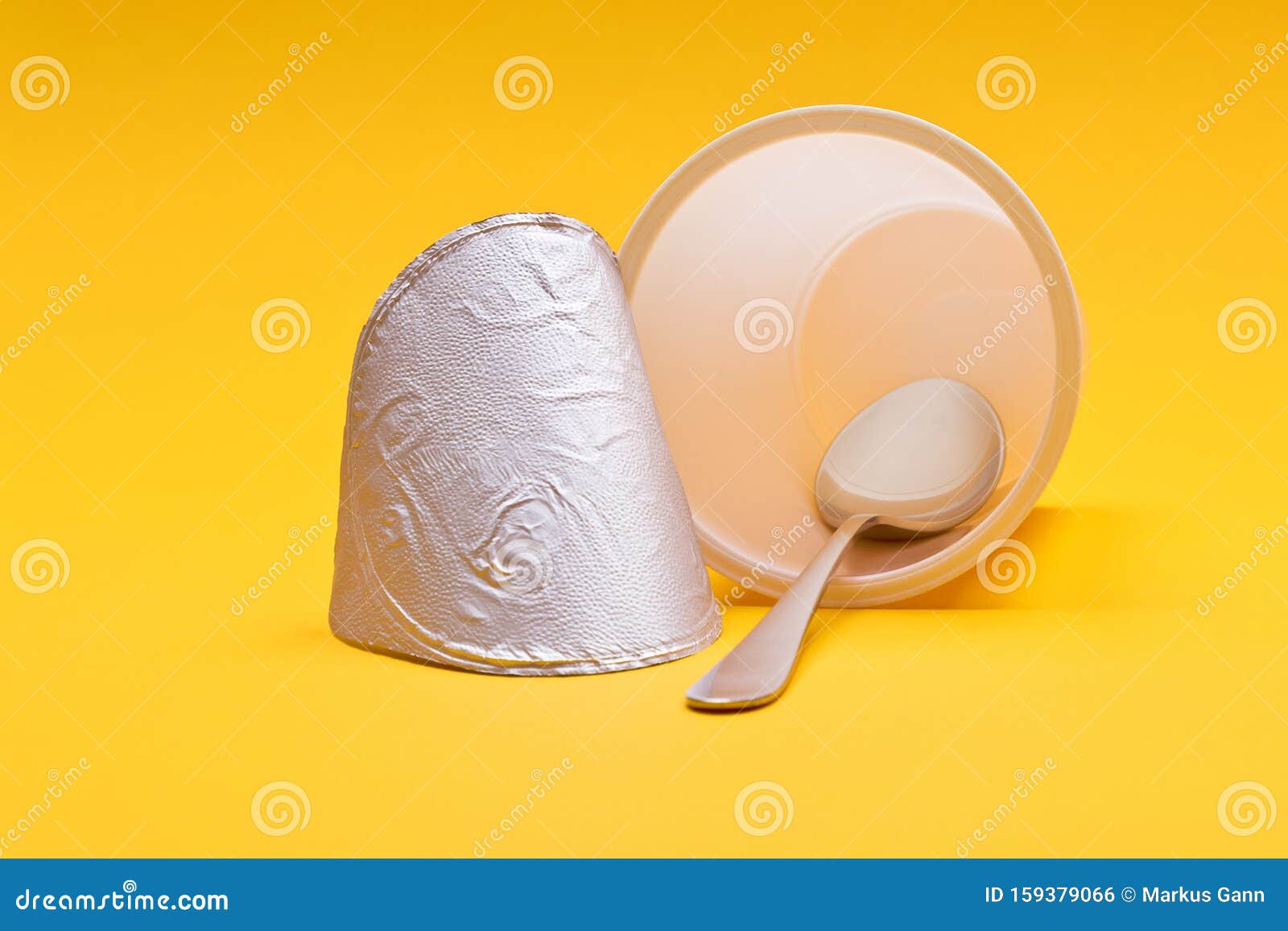 Empty Clean Yogurt Cup with Spoon on an Orange Background Stock Photo ...