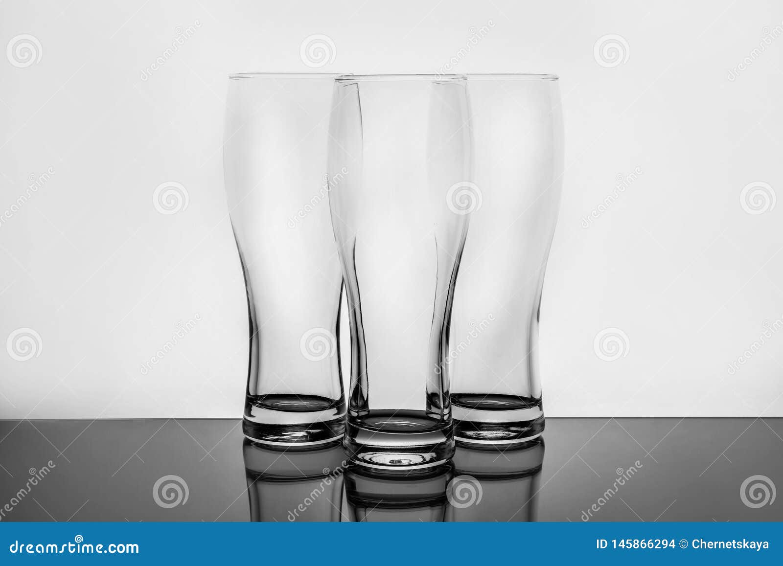 Empty clear beer glasses stock photo. Image of light - 145866294