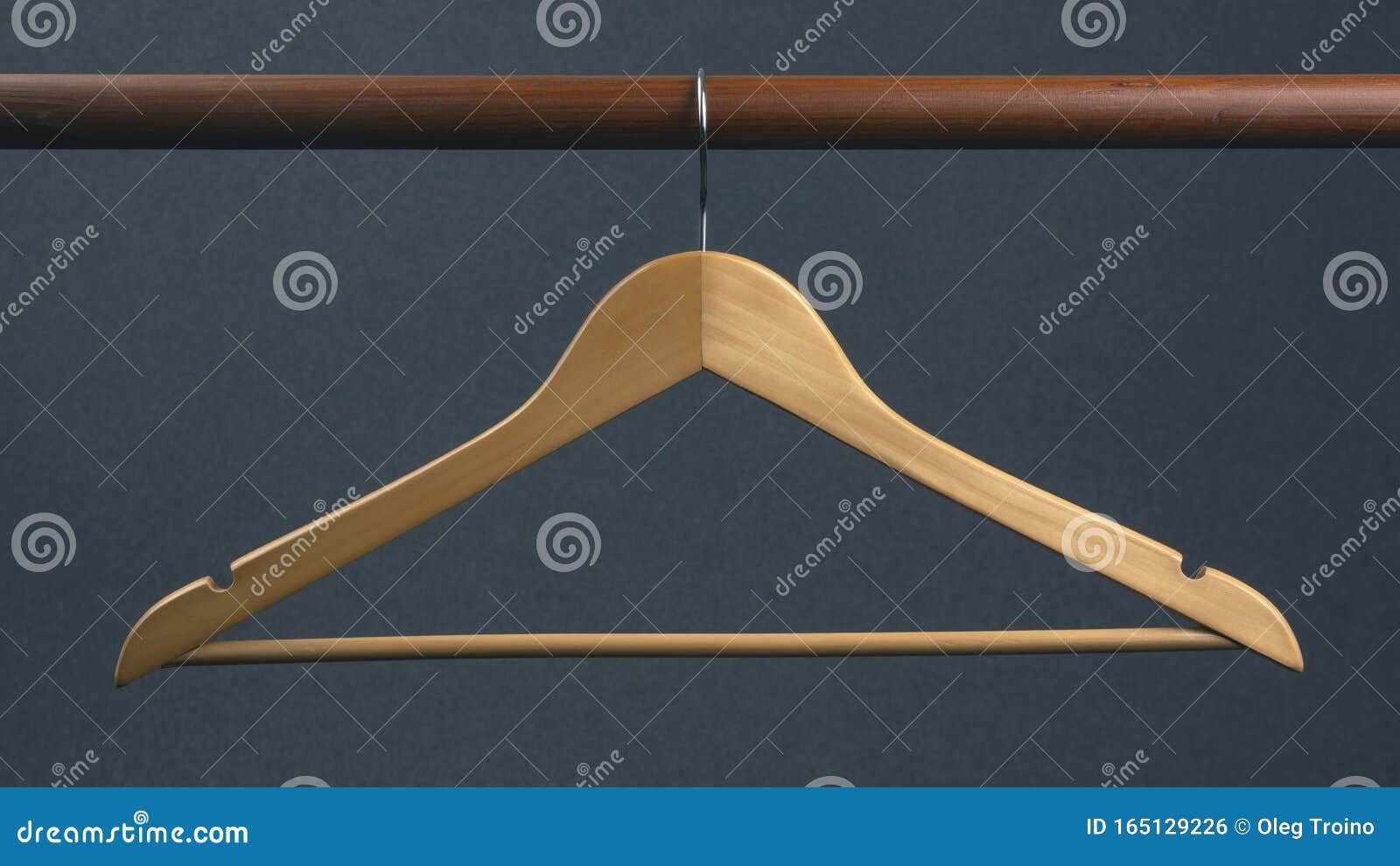 Empty Clothes Hanger Hanging on a Gray Background. Accessories and ...