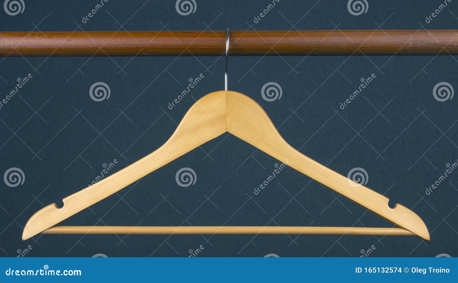 Empty Clothes Hanger Hanging on a Gray Background. Accessories and ...