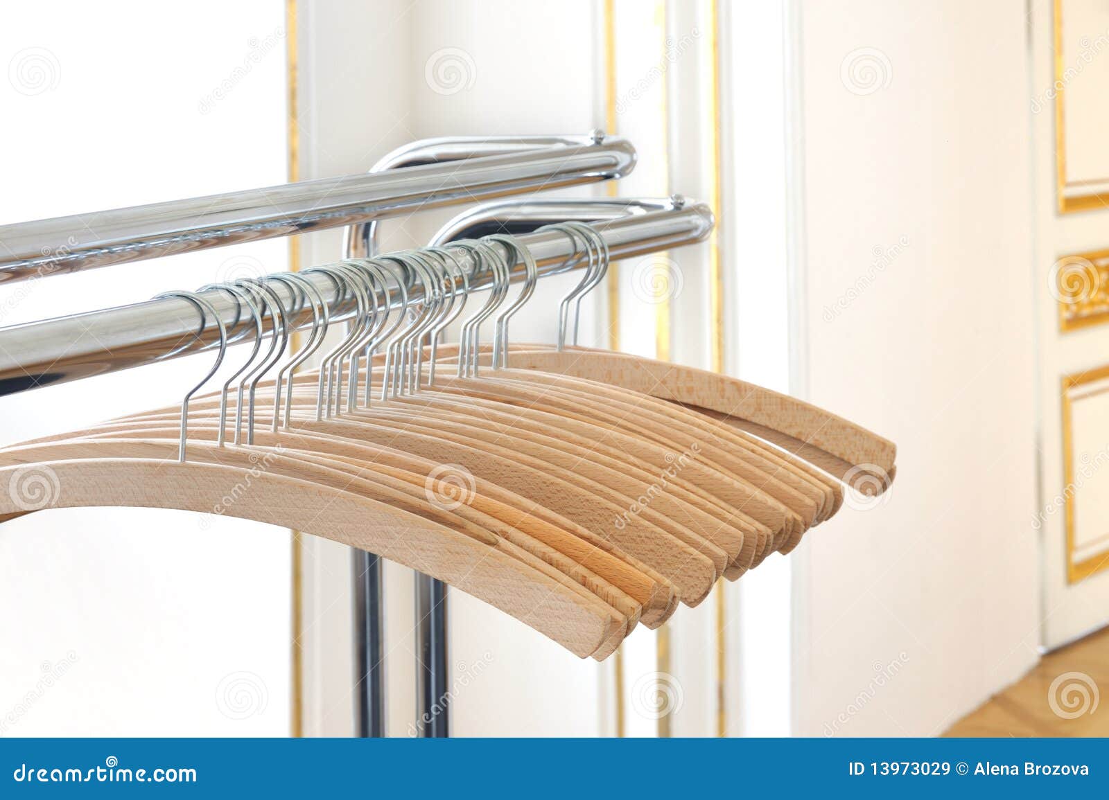 Empty Clothes Hangers On A Wardrobe Rack On A Colored Background ...