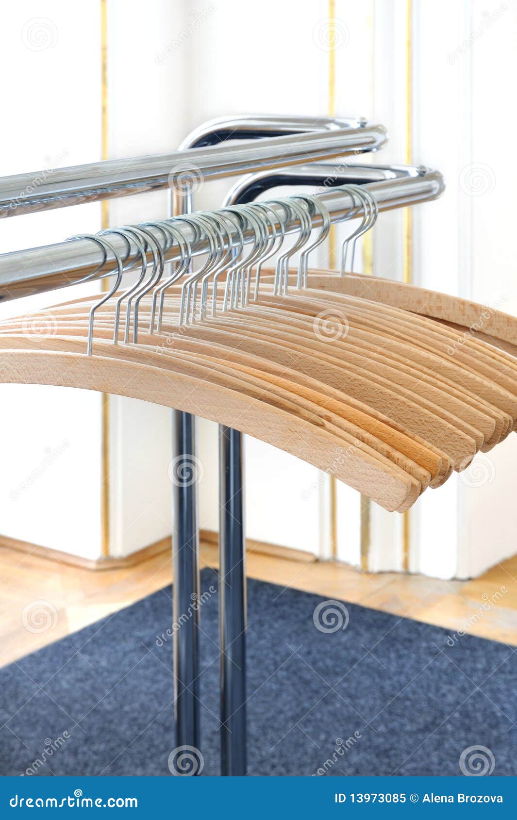 Empty Clothes Hangers On A Wardrobe Rack On A Colored Background ...