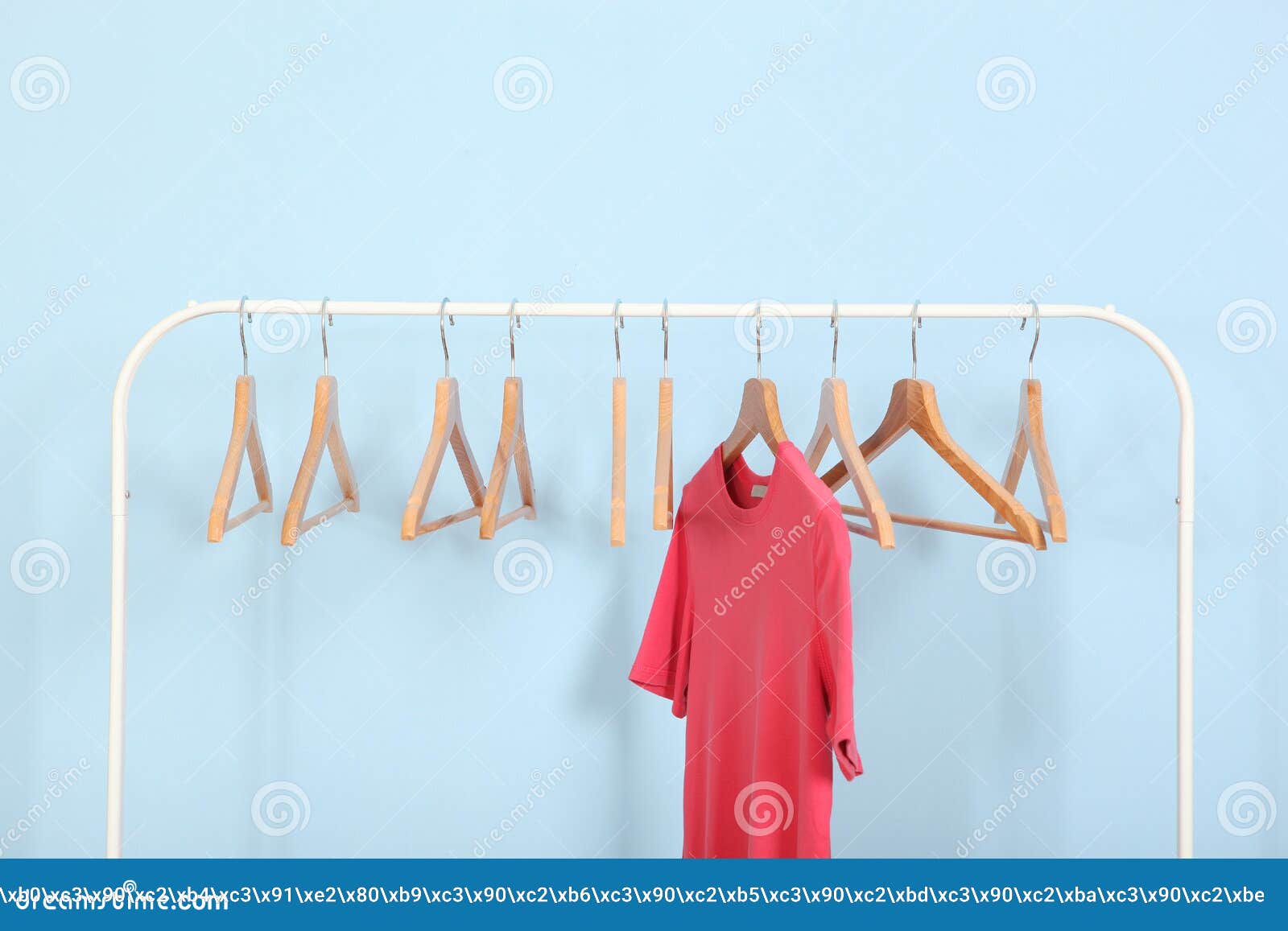 Empty Clothes Hangers On A Wardrobe Rack On A Colored Background. Stock ...