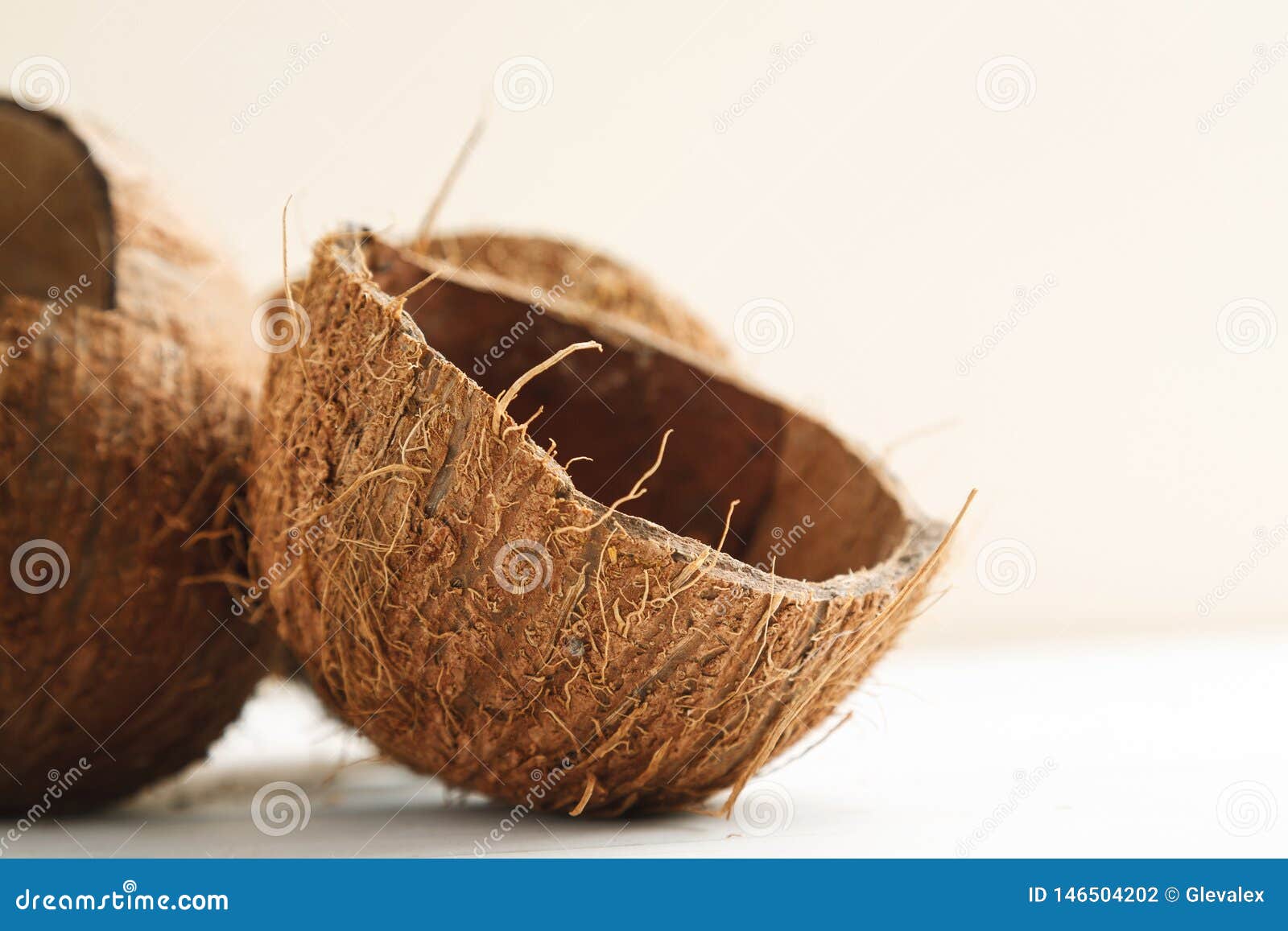 Empty Coconut Shells on a White Wooden Table, Macro Stock Photo - Image ...
