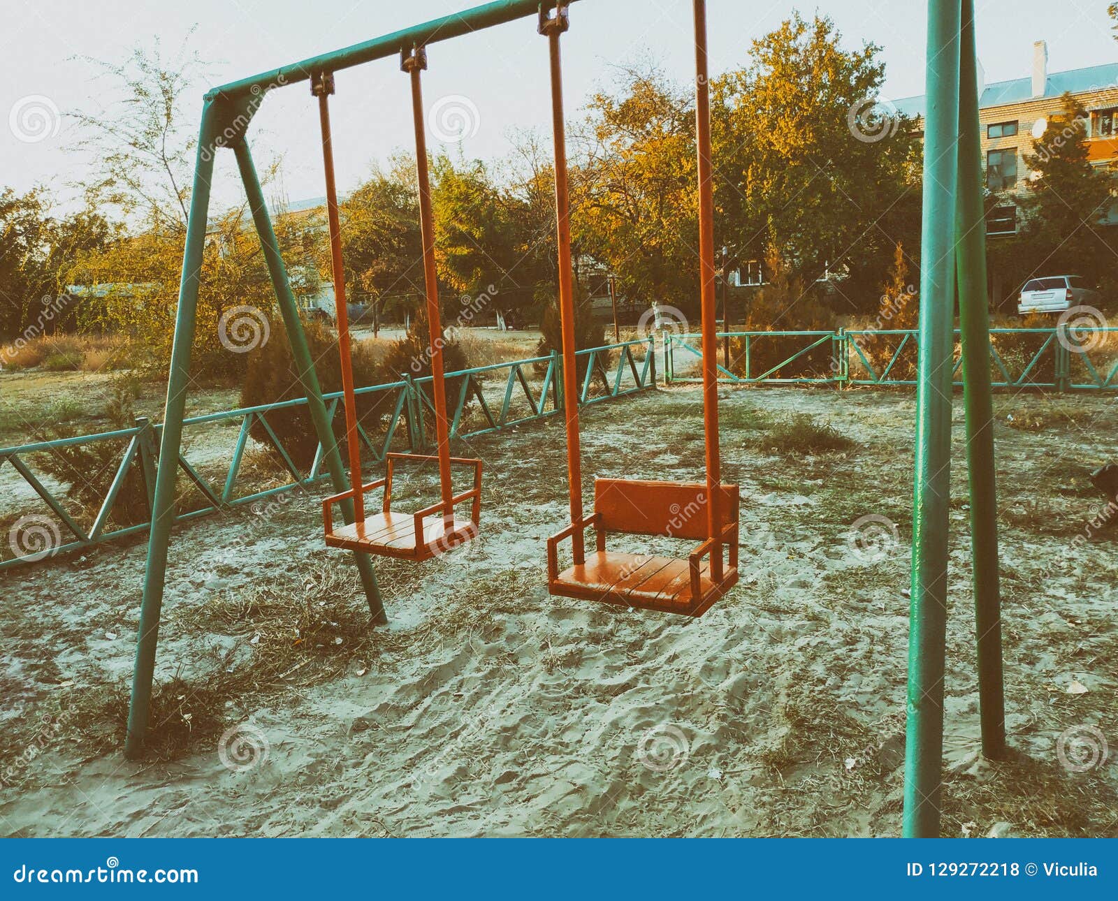 Empty Colorful Swing Set in Playground in Park Stock Photo - Image of ...