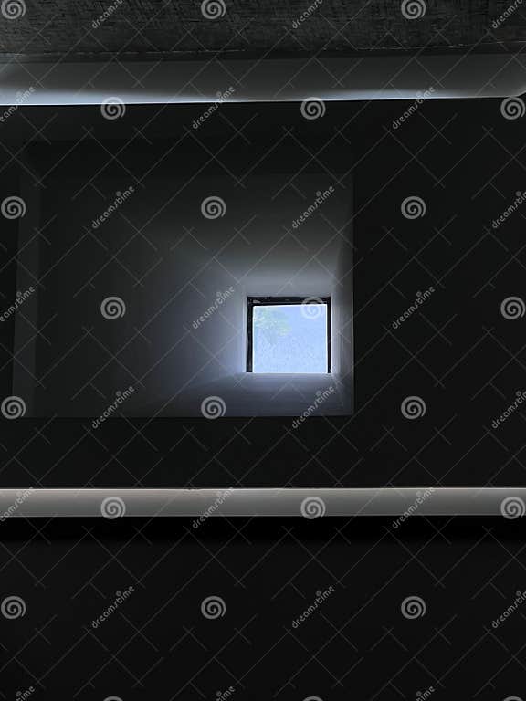 Empty Dark Room with a Skylight Shining through the Window Stock Image ...