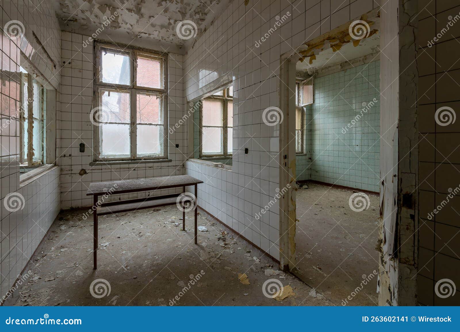 Empty Decaying Room with a Table and Torn Ceramic Walls in an Abandoned ...