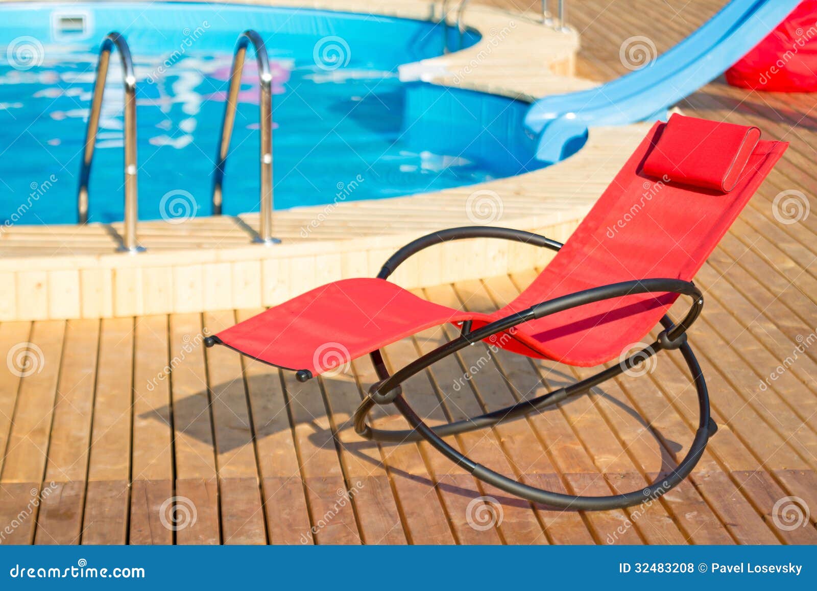 Empty deck-chair near pool stock photo. Image of pool - 32483208