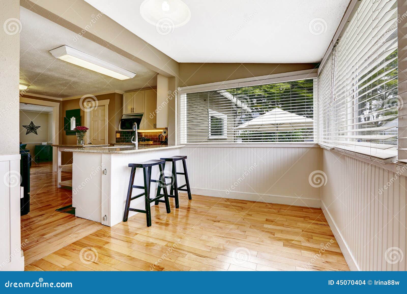 Empty Dining Area with White Plank Trim Stock Photo - Image of ...