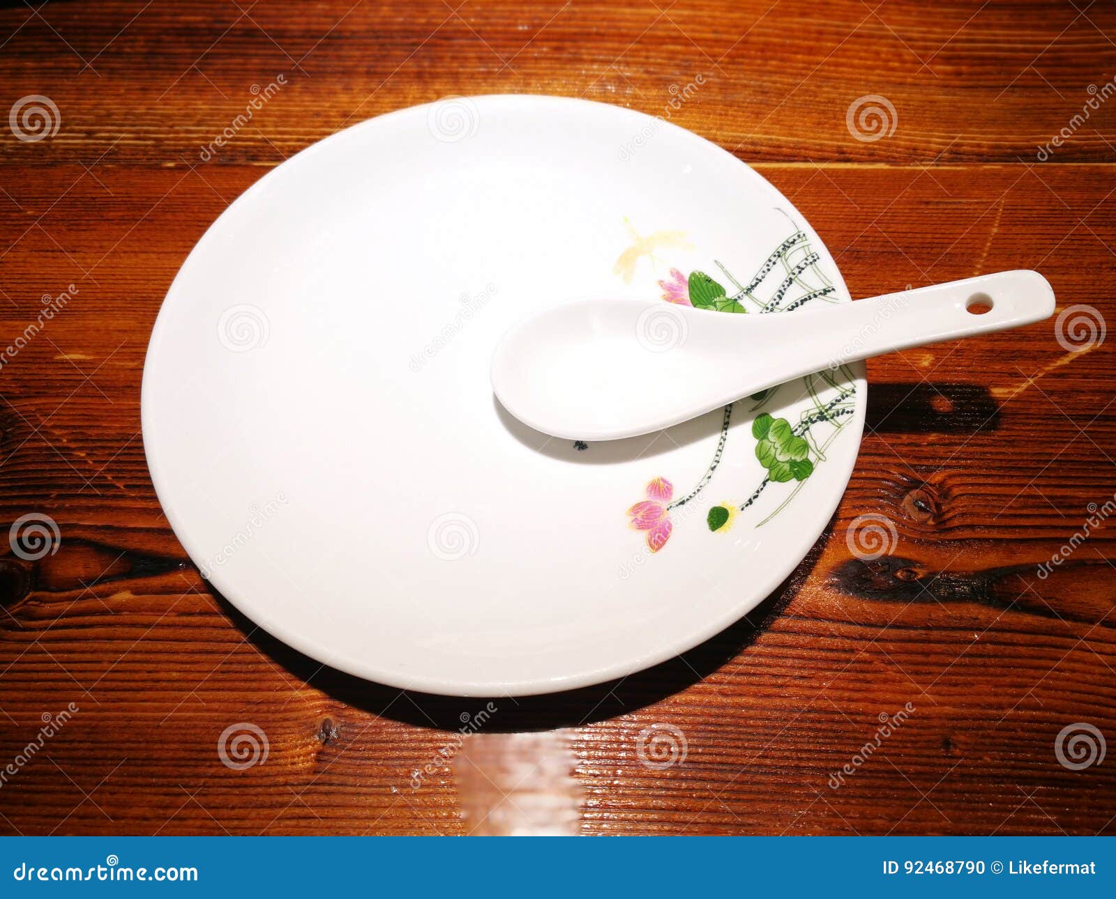 Empty Dinner Plate with Spoon Stock Photo - Image of pattern, table ...