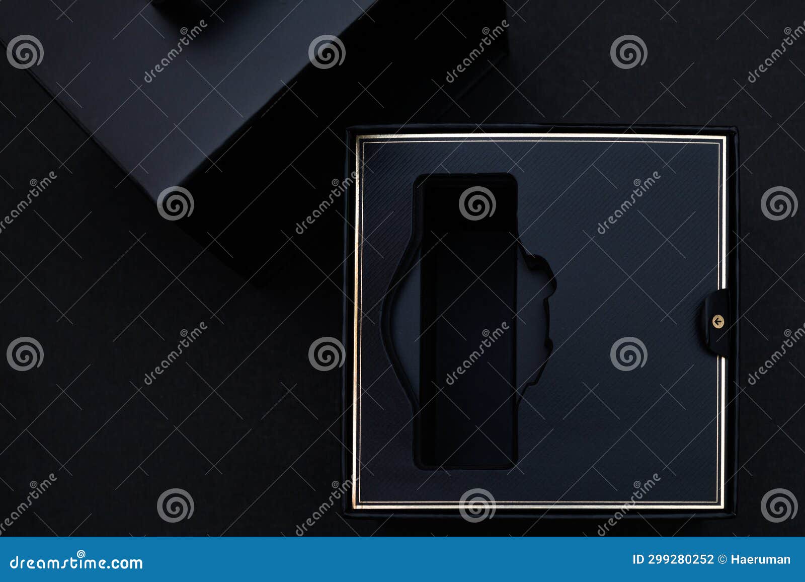 Empty Elegant Black Smartwatch Box with Gold Strip on Black Background ...