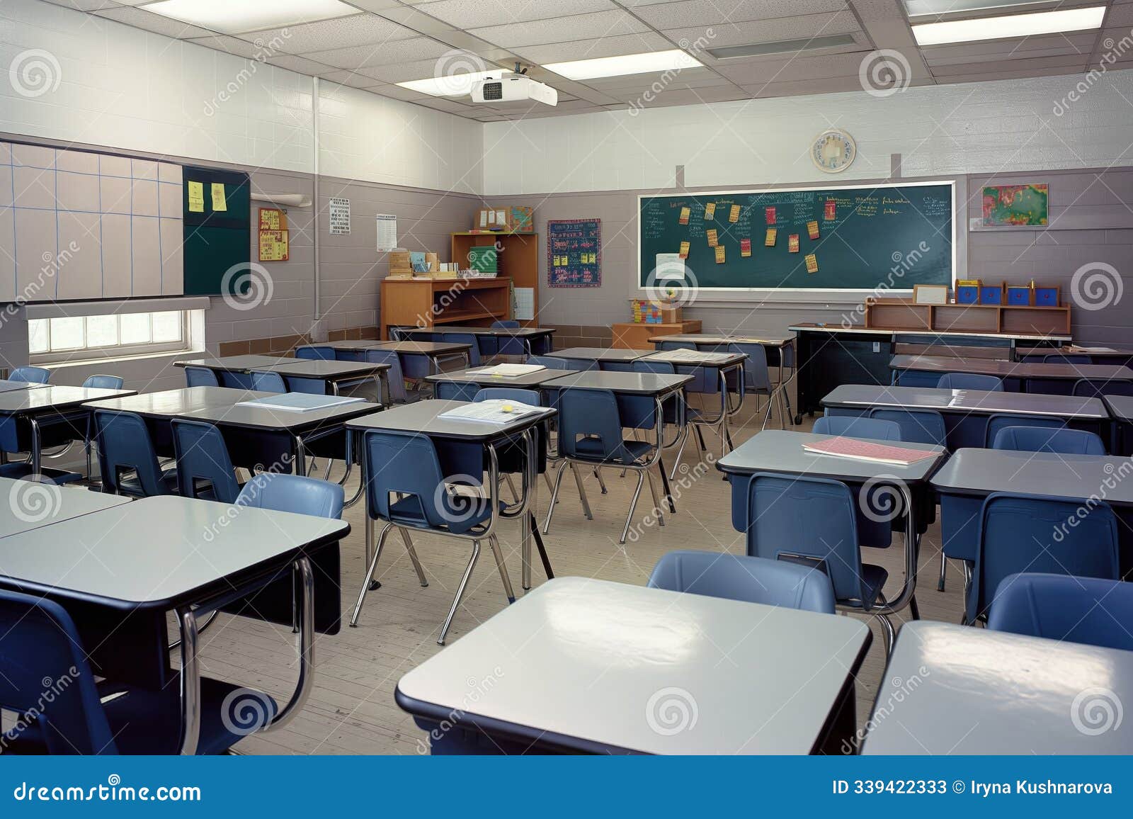 Empty Elementary School Classroom Interior with Blue Desks and Chairs. White Walls, Gray Tiles ...