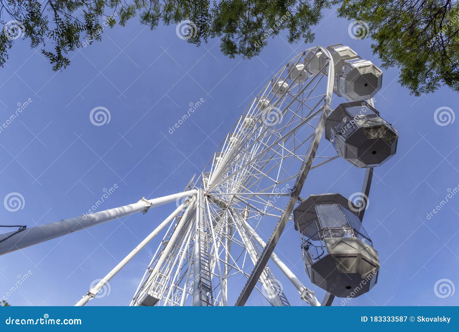 Empty Ferris Wheel with a Blue Sky in the Background Stock Image ...