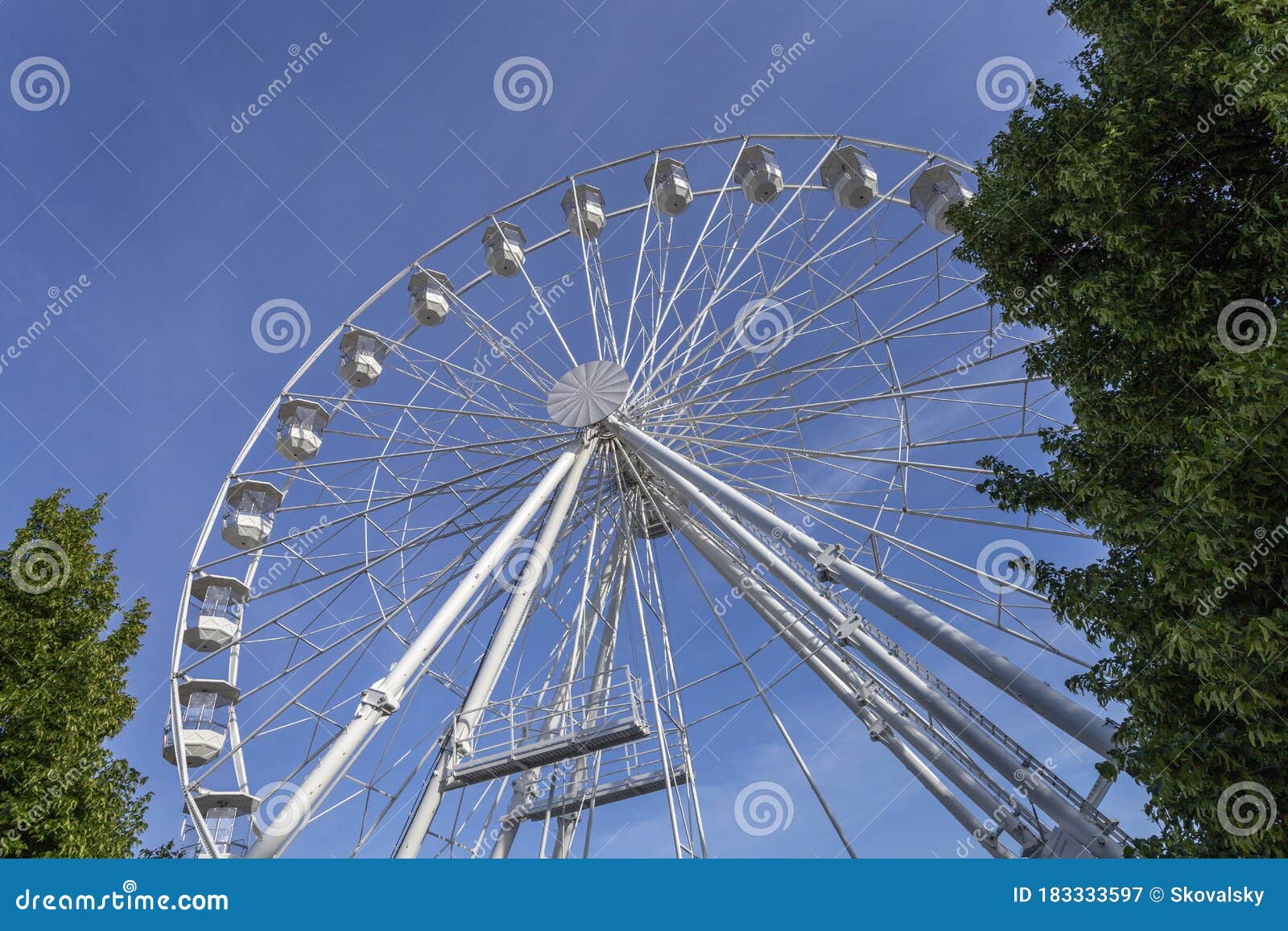 Empty Ferris Wheel with a Blue Sky in the Background Stock Image ...