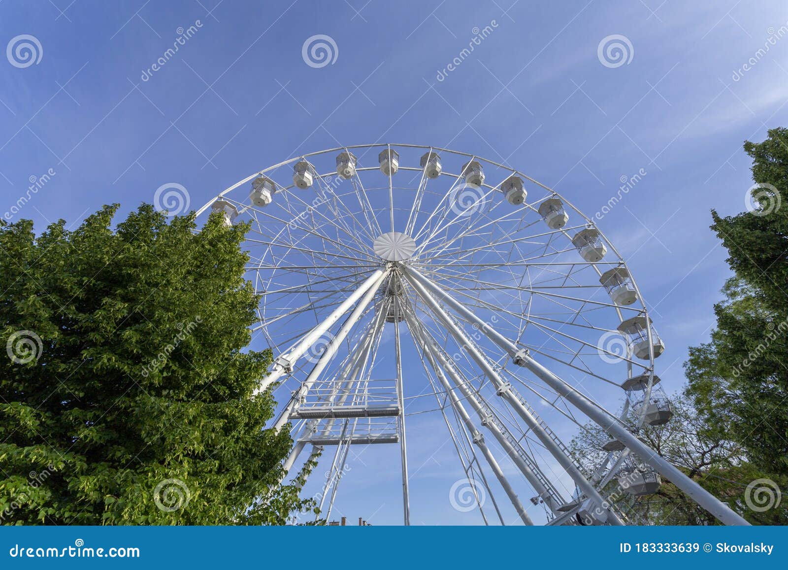 Empty Ferris Wheel with a Blue Sky in the Background Stock Image ...