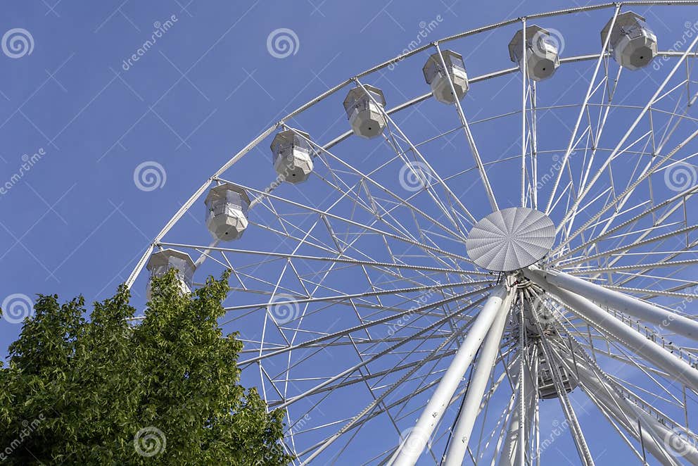 Empty Ferris Wheel with a Blue Sky in the Background Stock Image ...