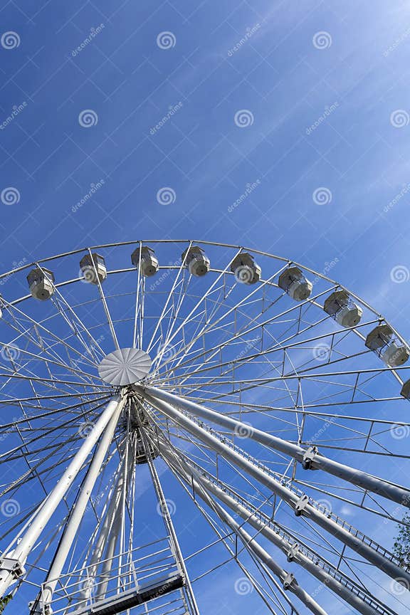 Empty Ferris Wheel with a Blue Sky in the Background Stock Image ...