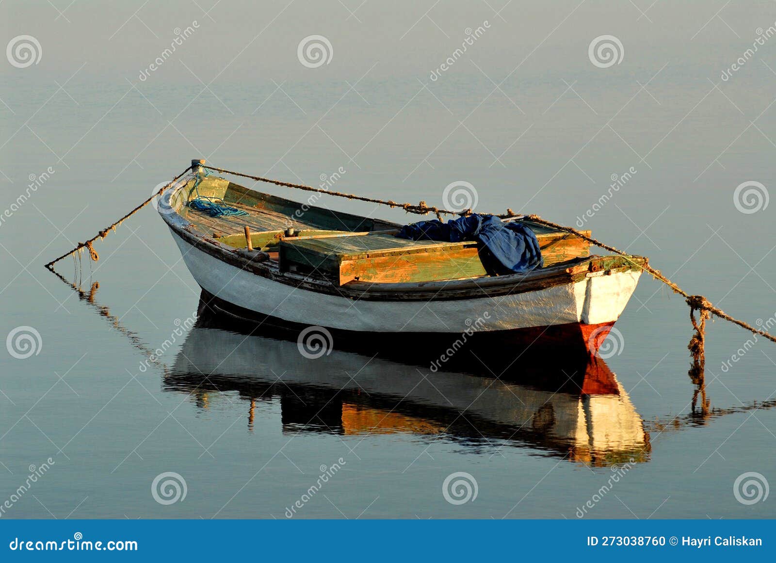 Fishing Boat and Its Reflection on the Sea Stock Photo - Image of ...