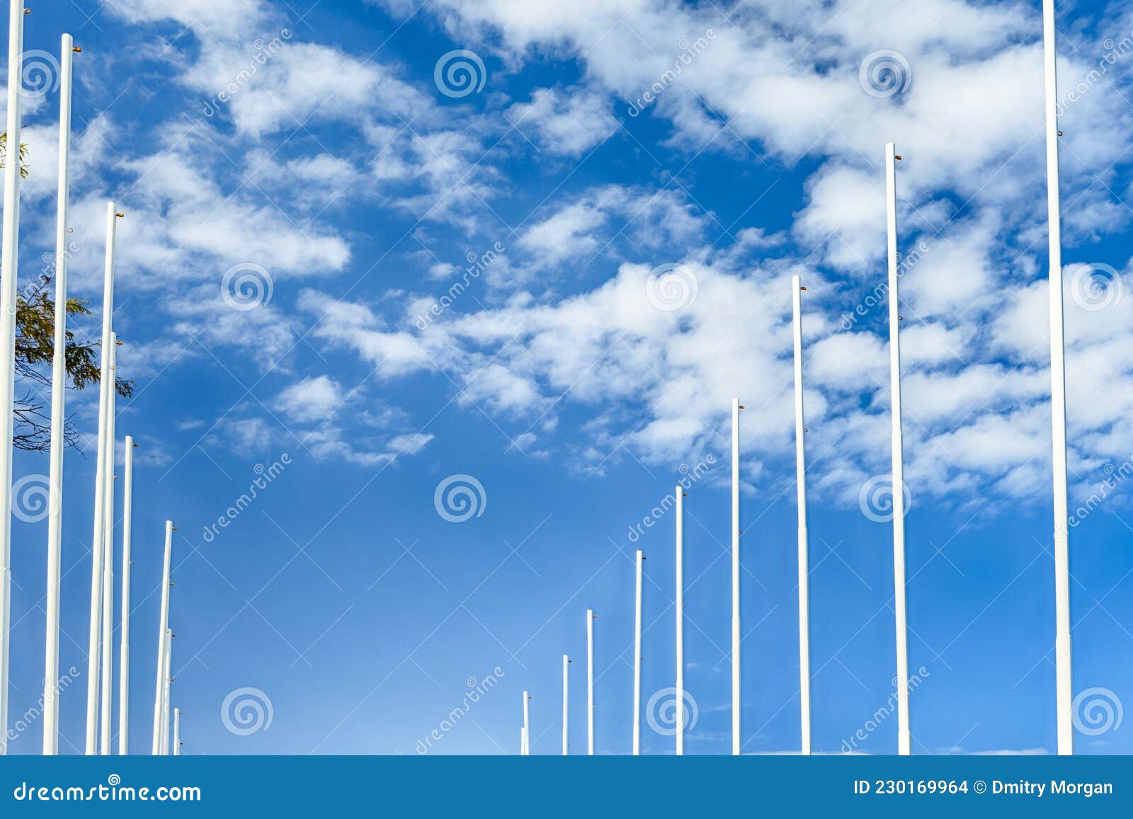 Empty Flag Poles Against BBlue Sky with Clouds Stock Photo - Image of ...