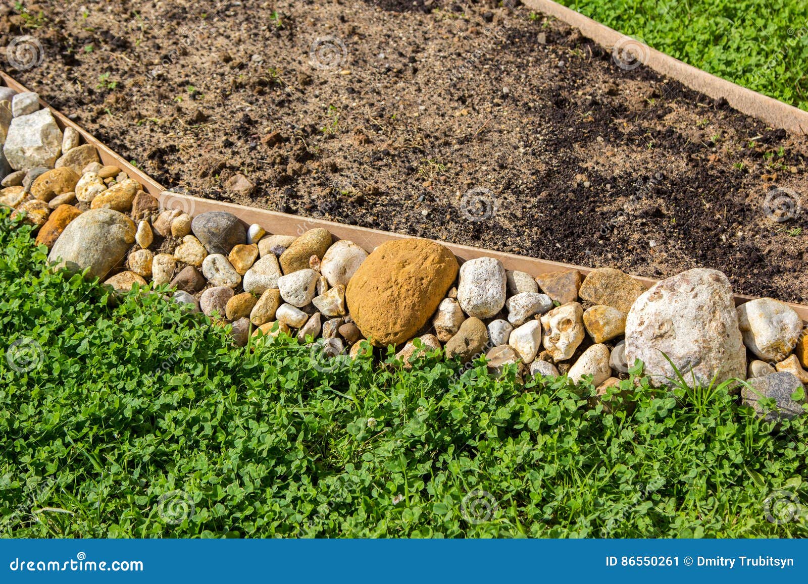 Empty Flower Bed Propped with Stones Stock Image - Image of empty ...