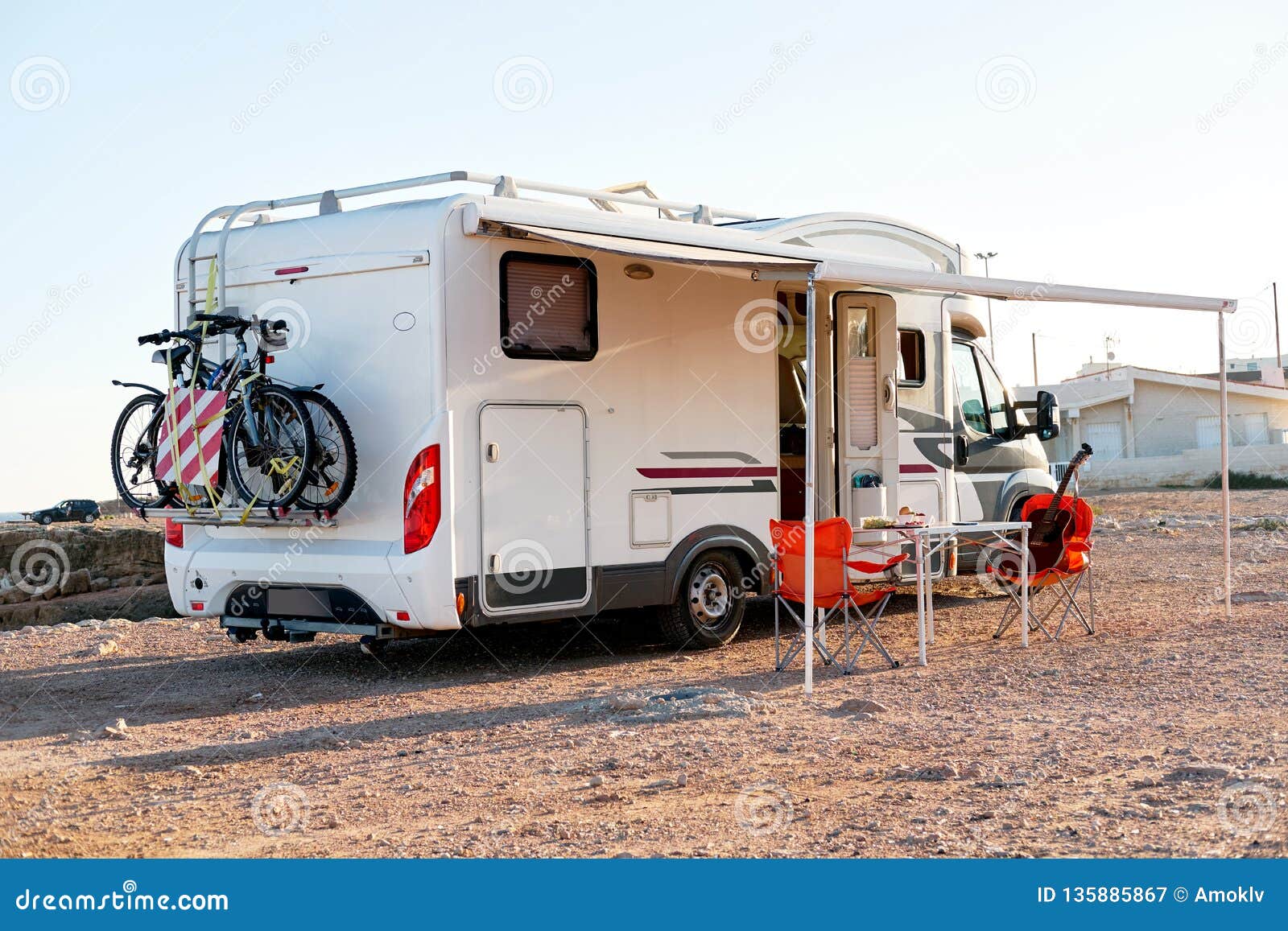 Empty Folding Chairs and Table Under Canopy Near Recreational Vehicle ...