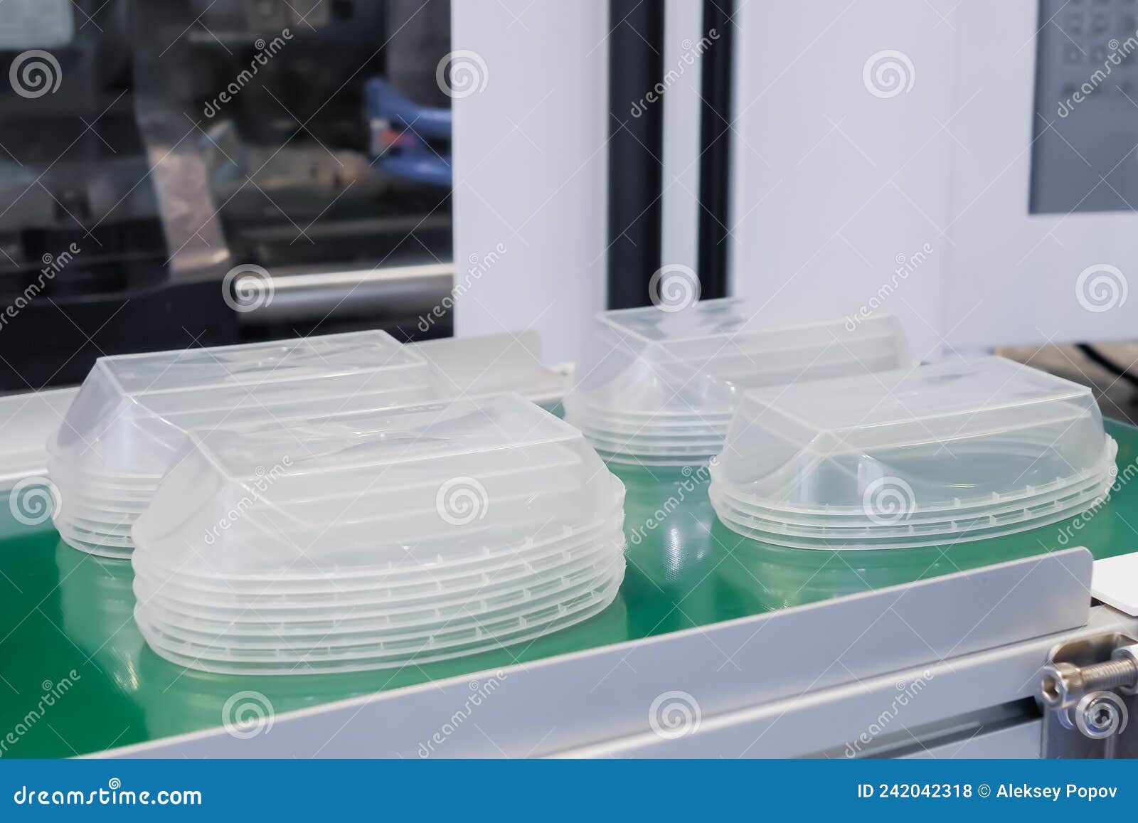 Empty Food Containers on Conveyor Belt of Plastic Injection Molding ...