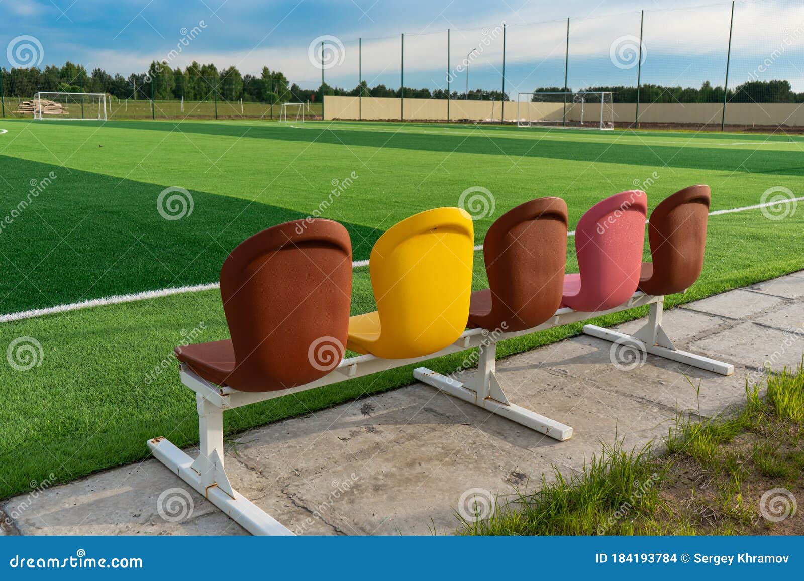 An Empty Football Field, Benches for the Reserves in the Foreground ...