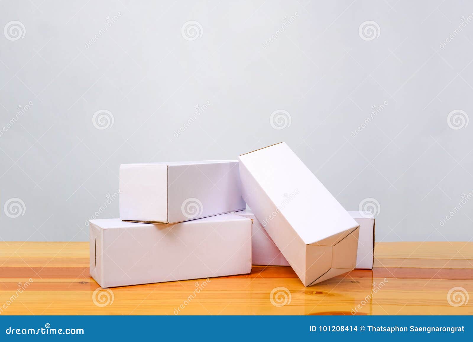 Empty Four Package White Cardboard Box for Long Items on Wooden Stock ...