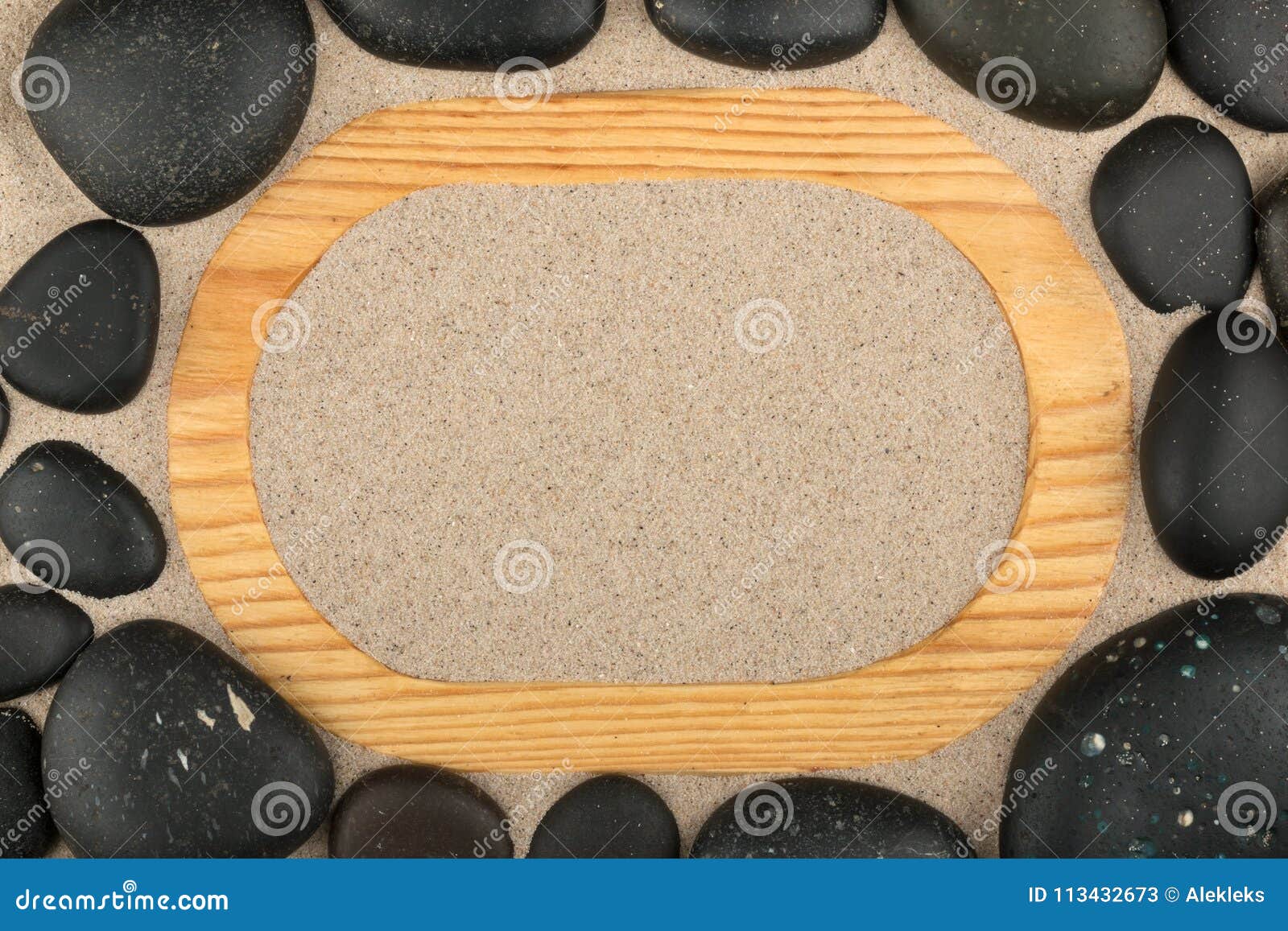 Empty Frame of Light Wood and Black Stones in the Sand. Copy Space ...