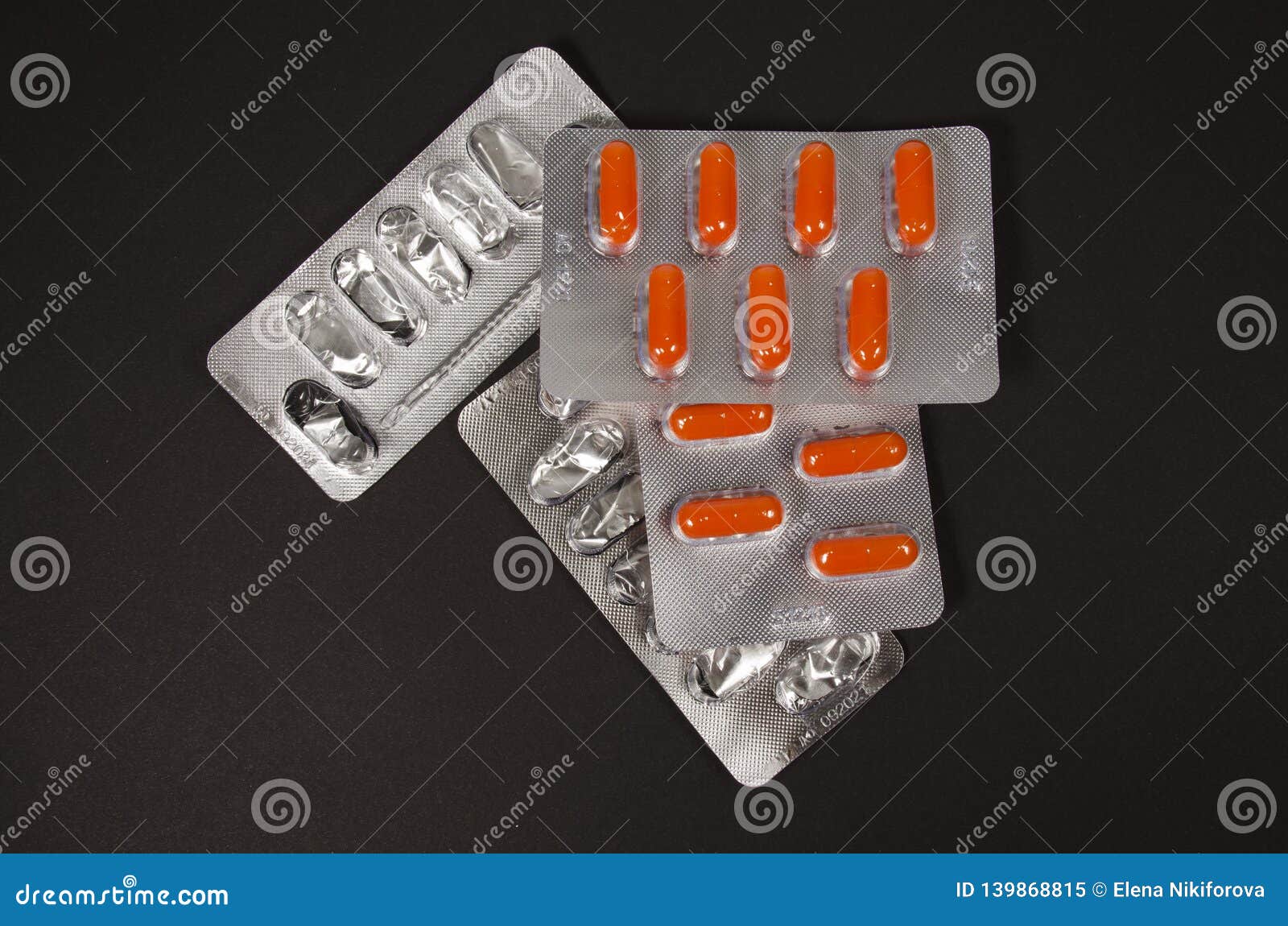 Empty and Full Silver Packages from Pills on a Dark Background Stock ...