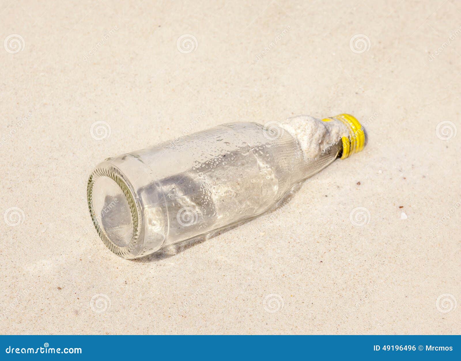 Empty Glass Bottle on Beach Sand Nearby Coastline. Stock Photo - Image ...