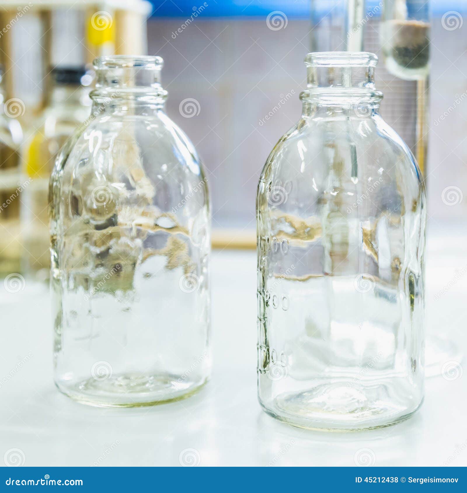 Empty Glass Bottles on Table in Laboratory Stock Photo - Image of ...