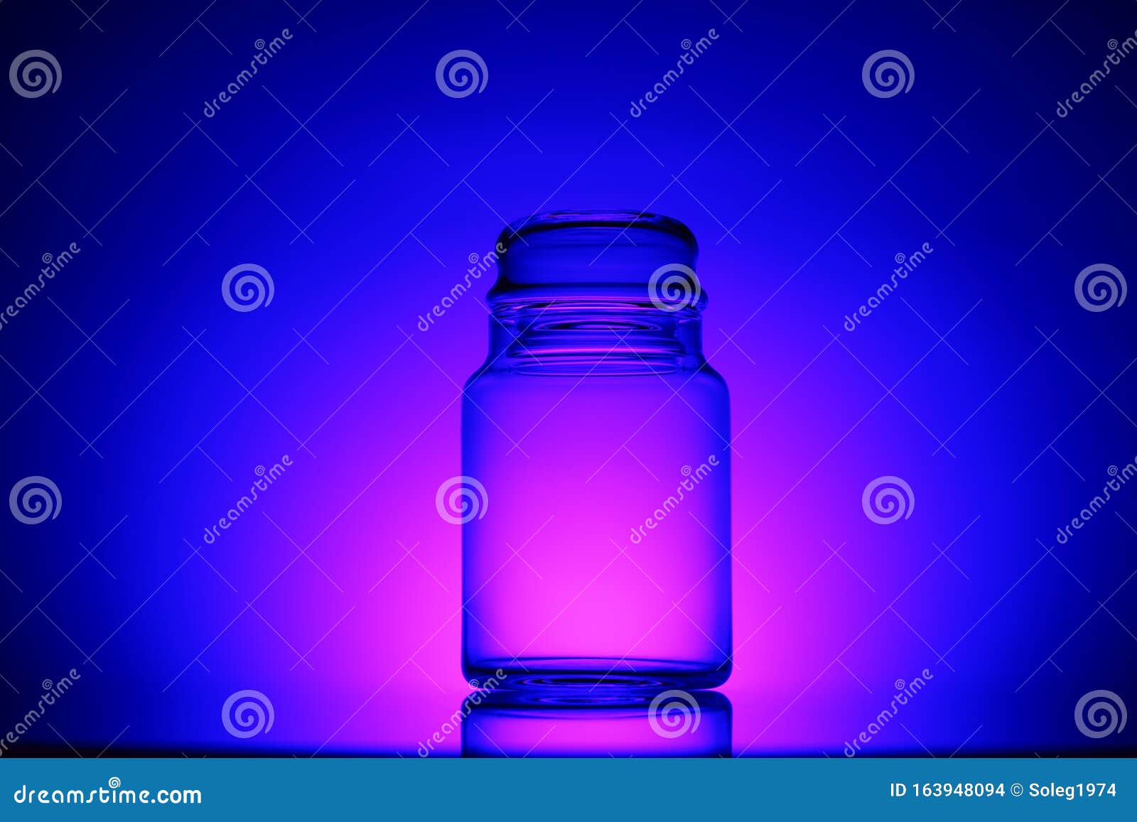 Empty Glass Jar on a Blue Background Stock Photo - Image of bottle ...