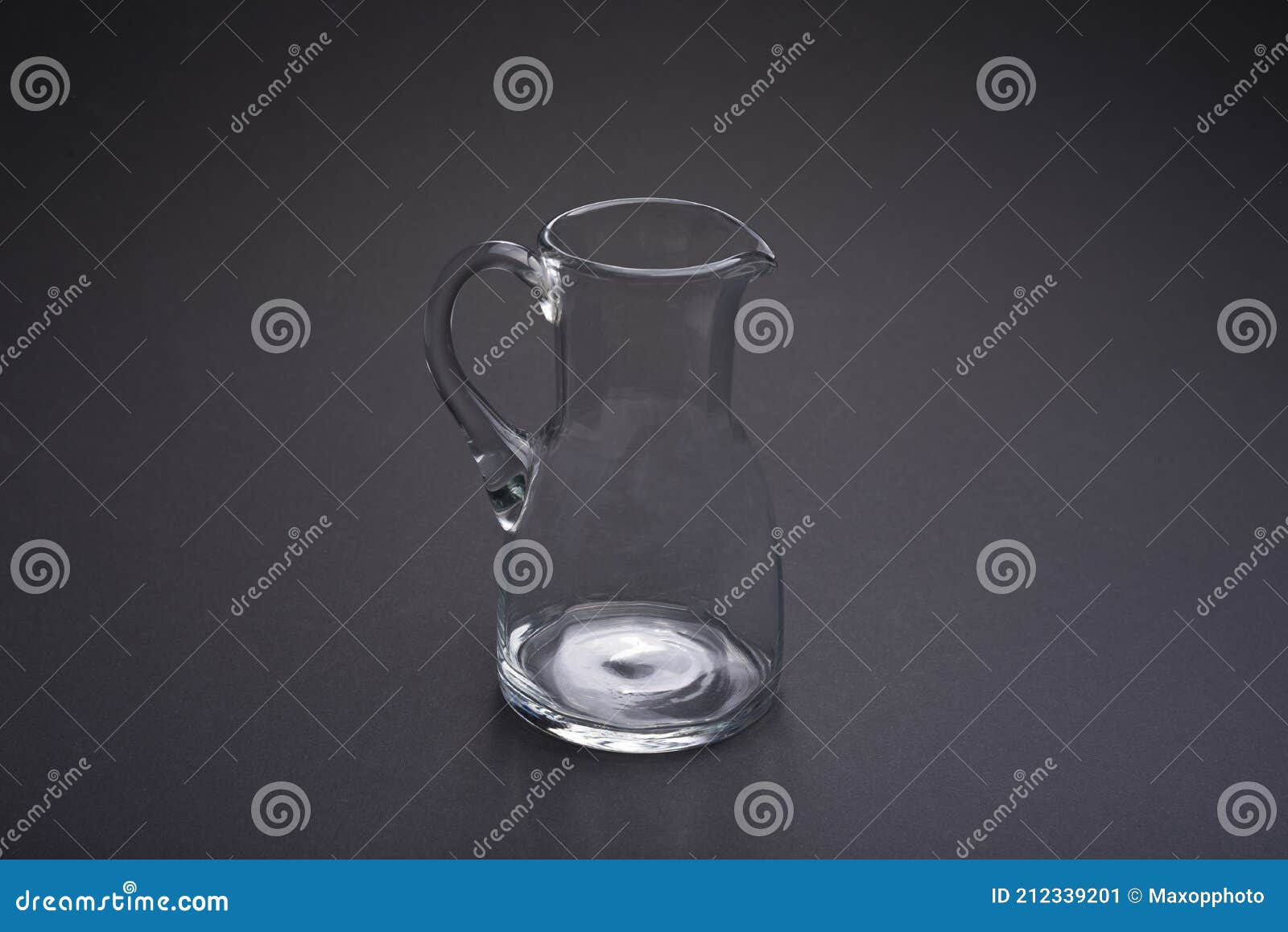 Empty Glass Pitcher on a Black Background Stock Image - Image of ...