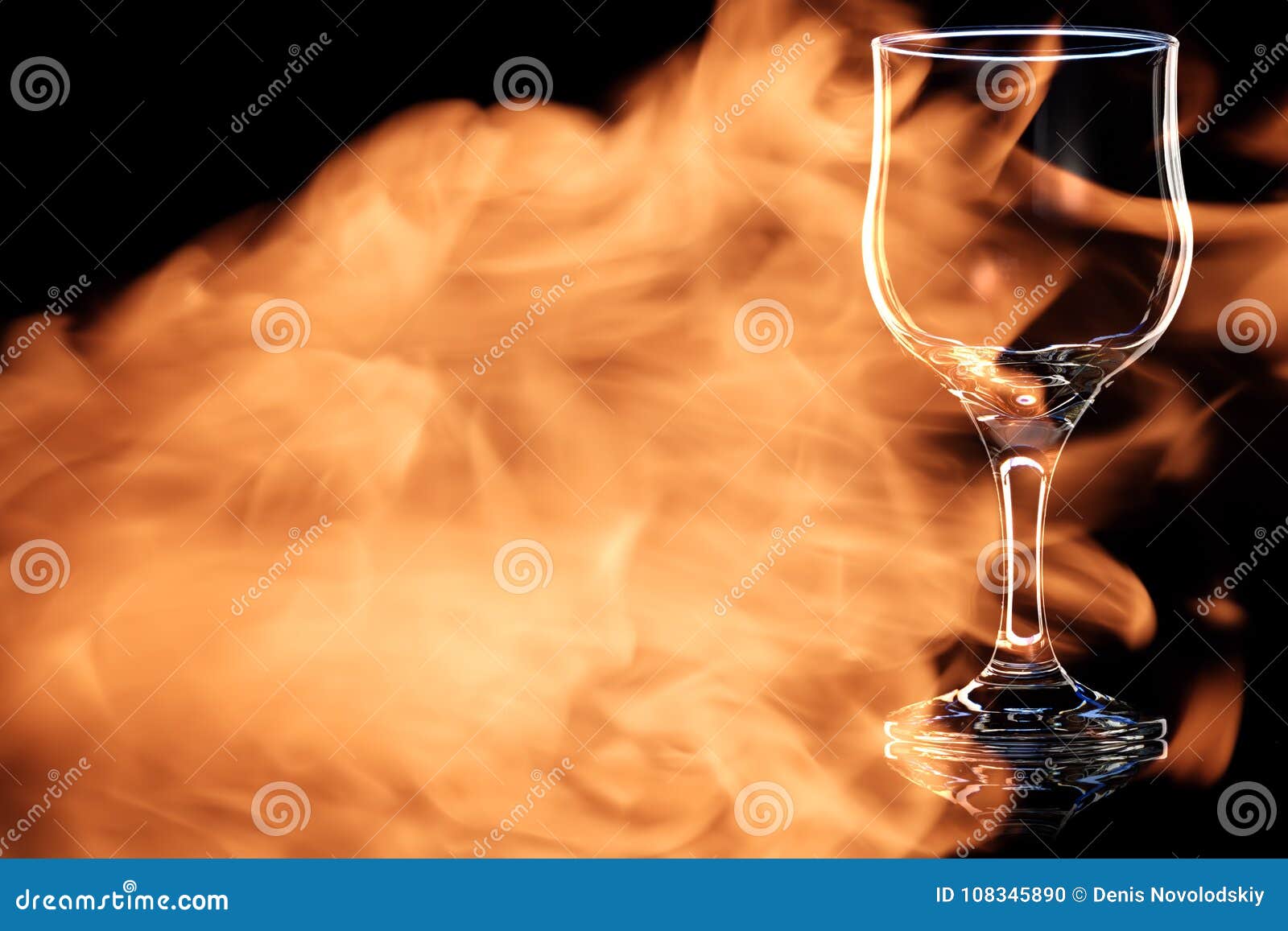 Empty Glass of Red Wine in the Fire Flames. Stock Photo - Image of ...