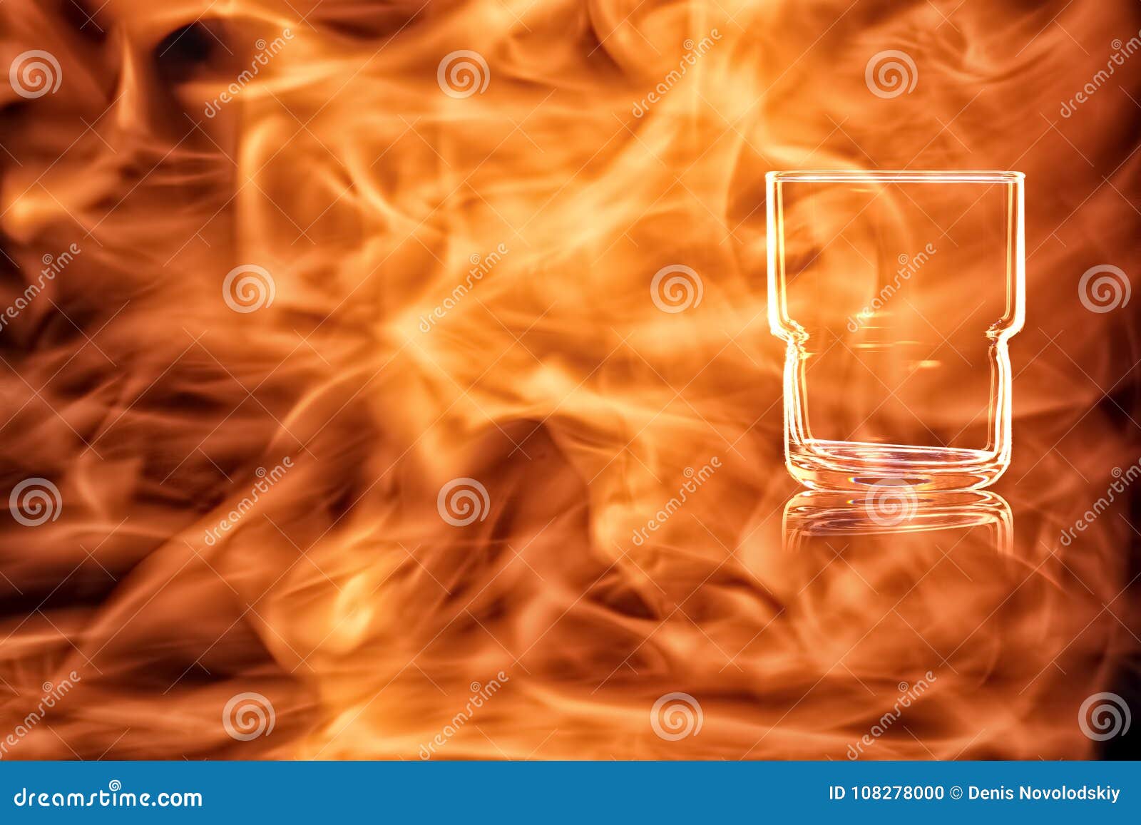 Empty Glass for Spirits in the Fire Flames. Stock Photo - Image of ...