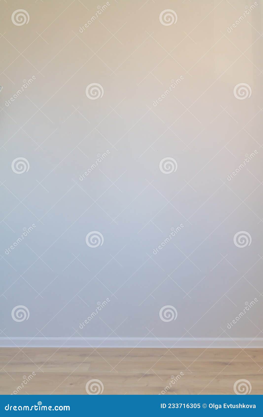An Empty Gray Wall and a Beige Background with a White Baseboard ...