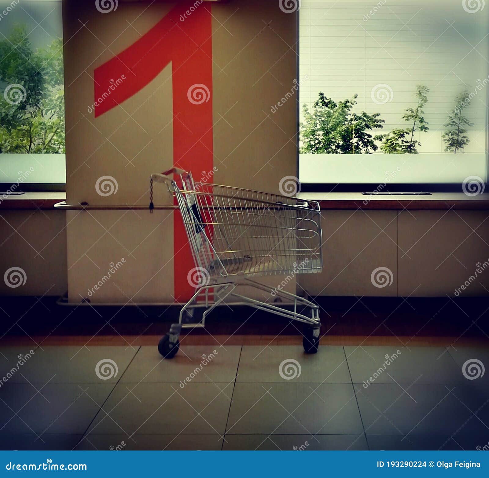Empty Grocery Cart in the Supermarket Next To the Number One. Stock ...