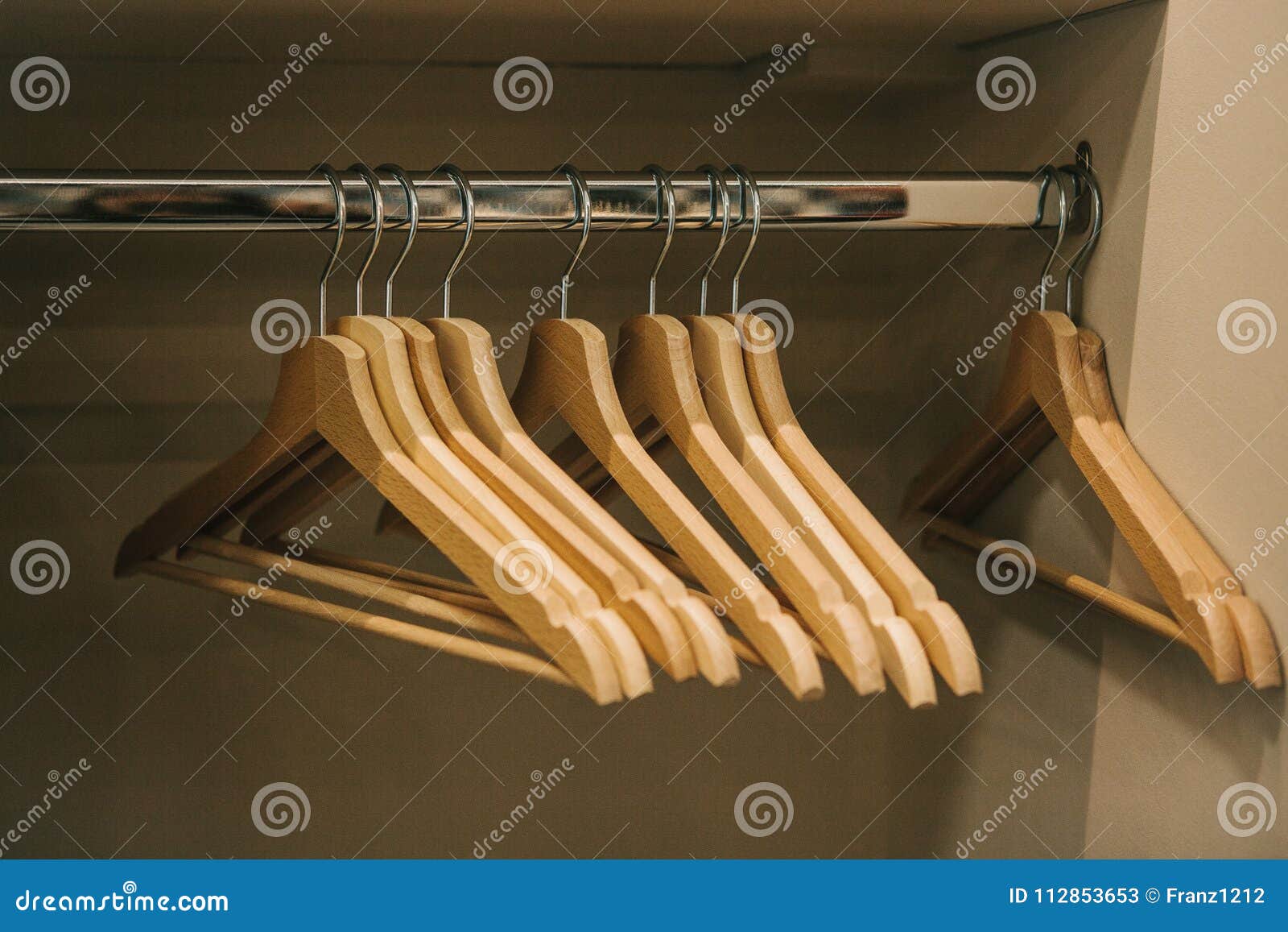 Empty Hangers Hang in a Row in the Closet Stock Image - Image of ...