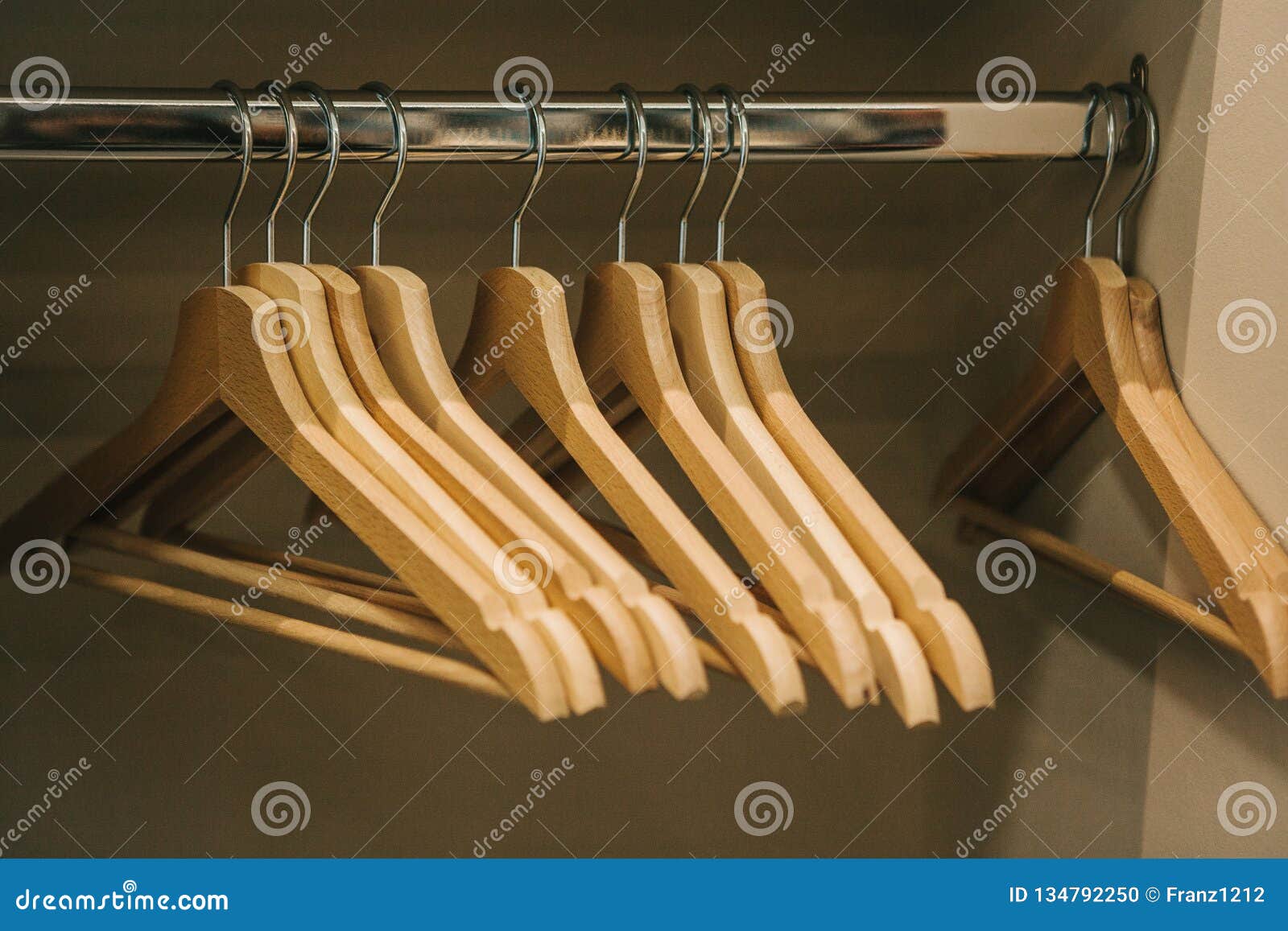 Empty Hangers Hang in a Row in the Closet Stock Photo - Image of rack ...