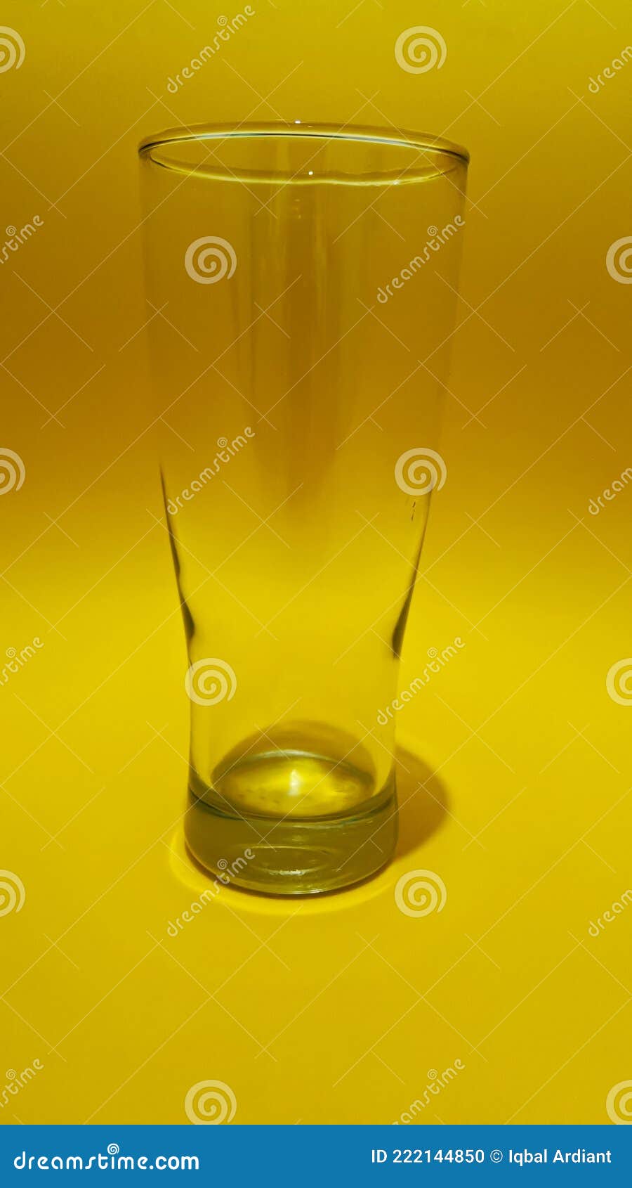 Empty Highball Glass Isolated on a Yellow Background. Stock Photo ...